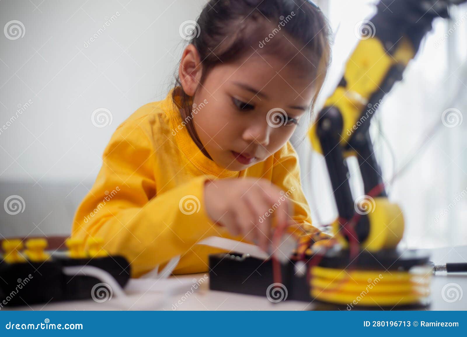 STEM Education Concept. Asian Students Learn at Home by Coding Robot ...