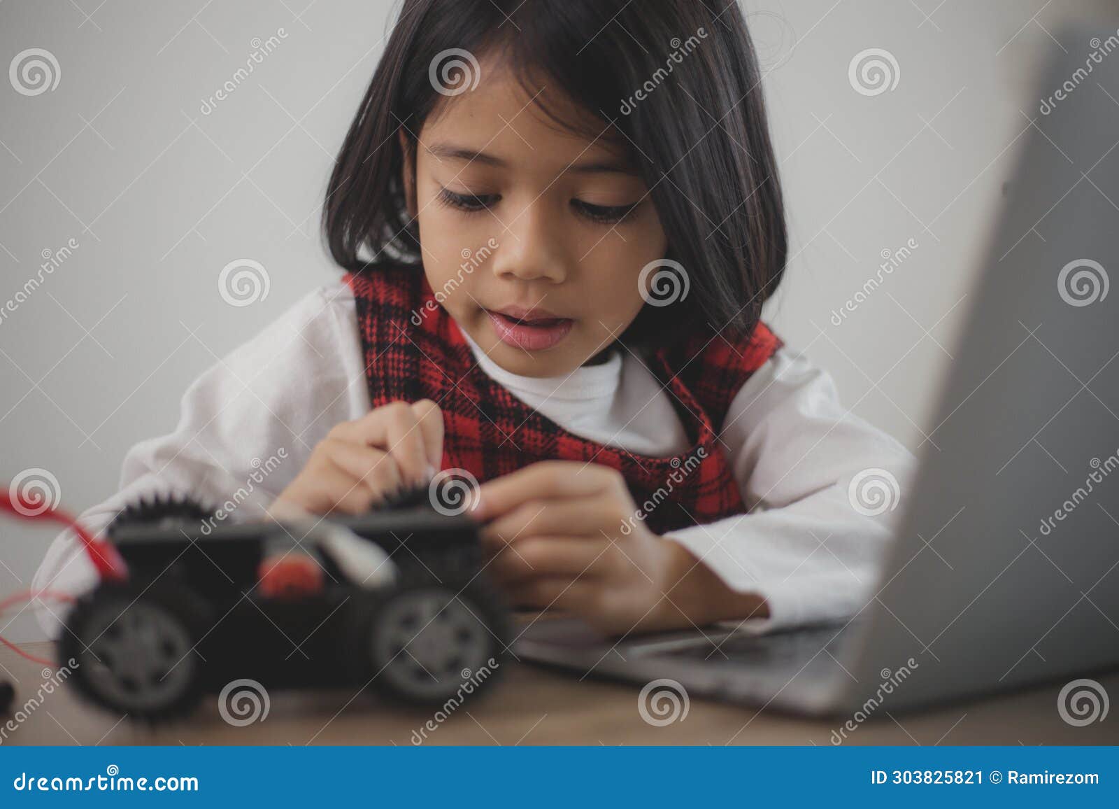 STEM Education Concept. Asian Students Learn at Home by Coding Robot ...