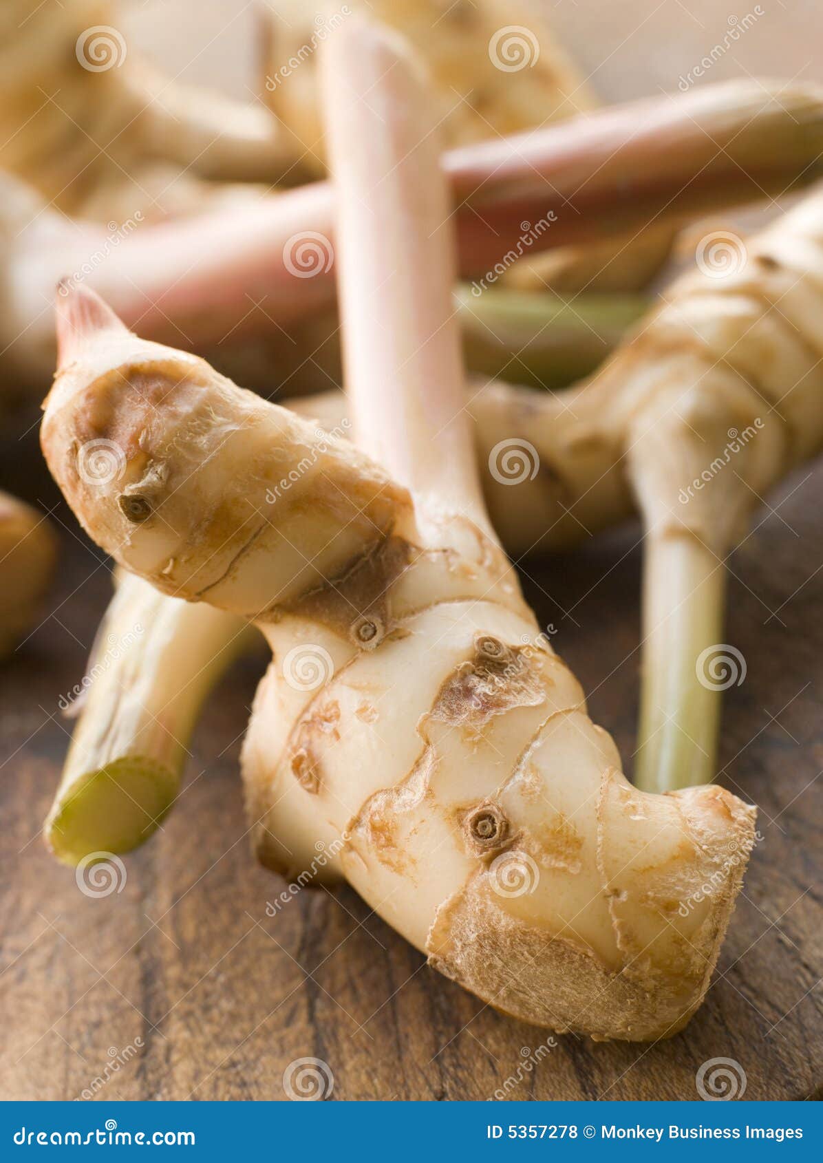 Galangal Root And Galanga Powder In Wooden Spoon On Rustic Table ...