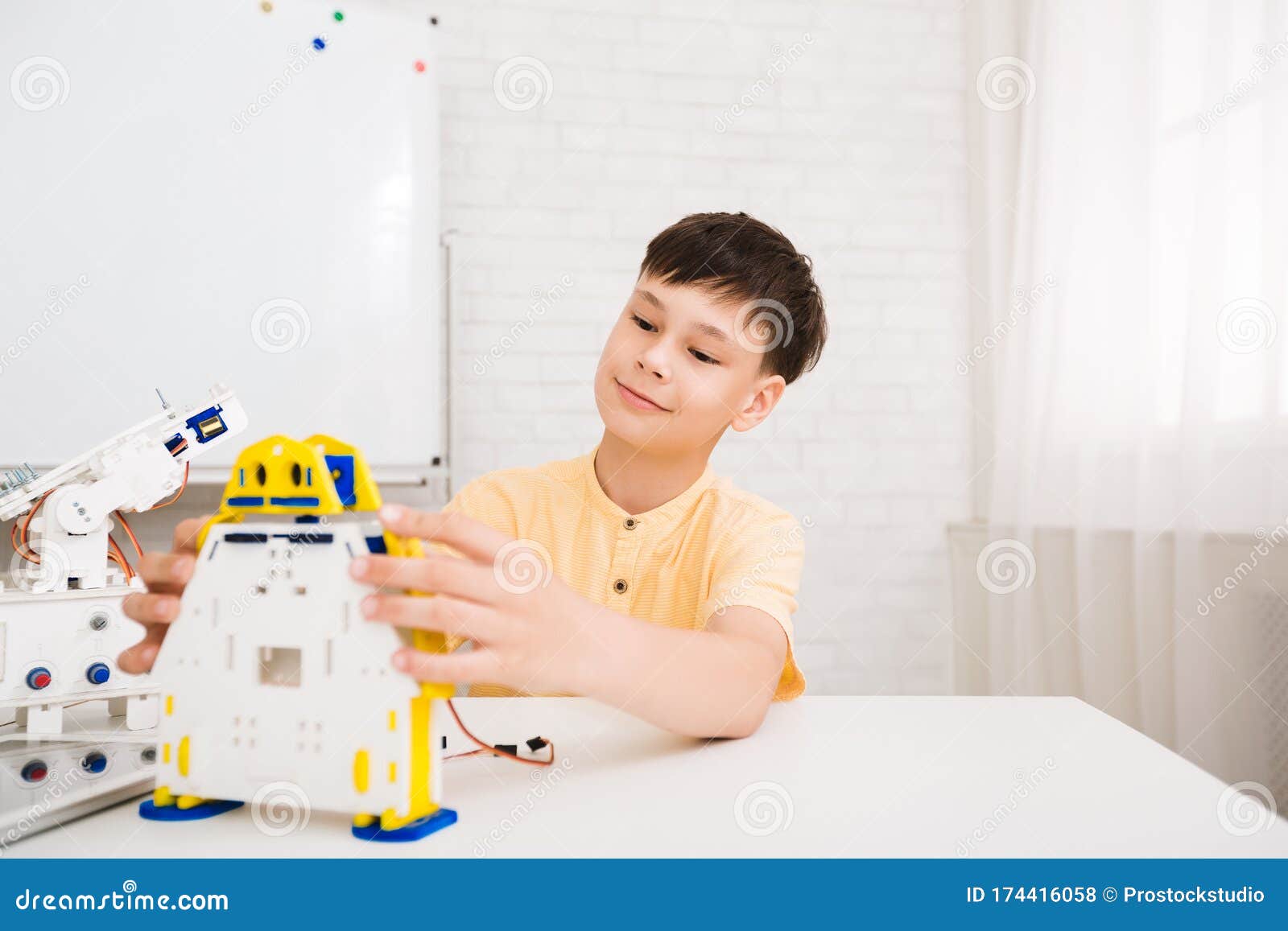 Stem Lesson. Clever Boy Constructing Electronic Toy Stock Photo - Image ...