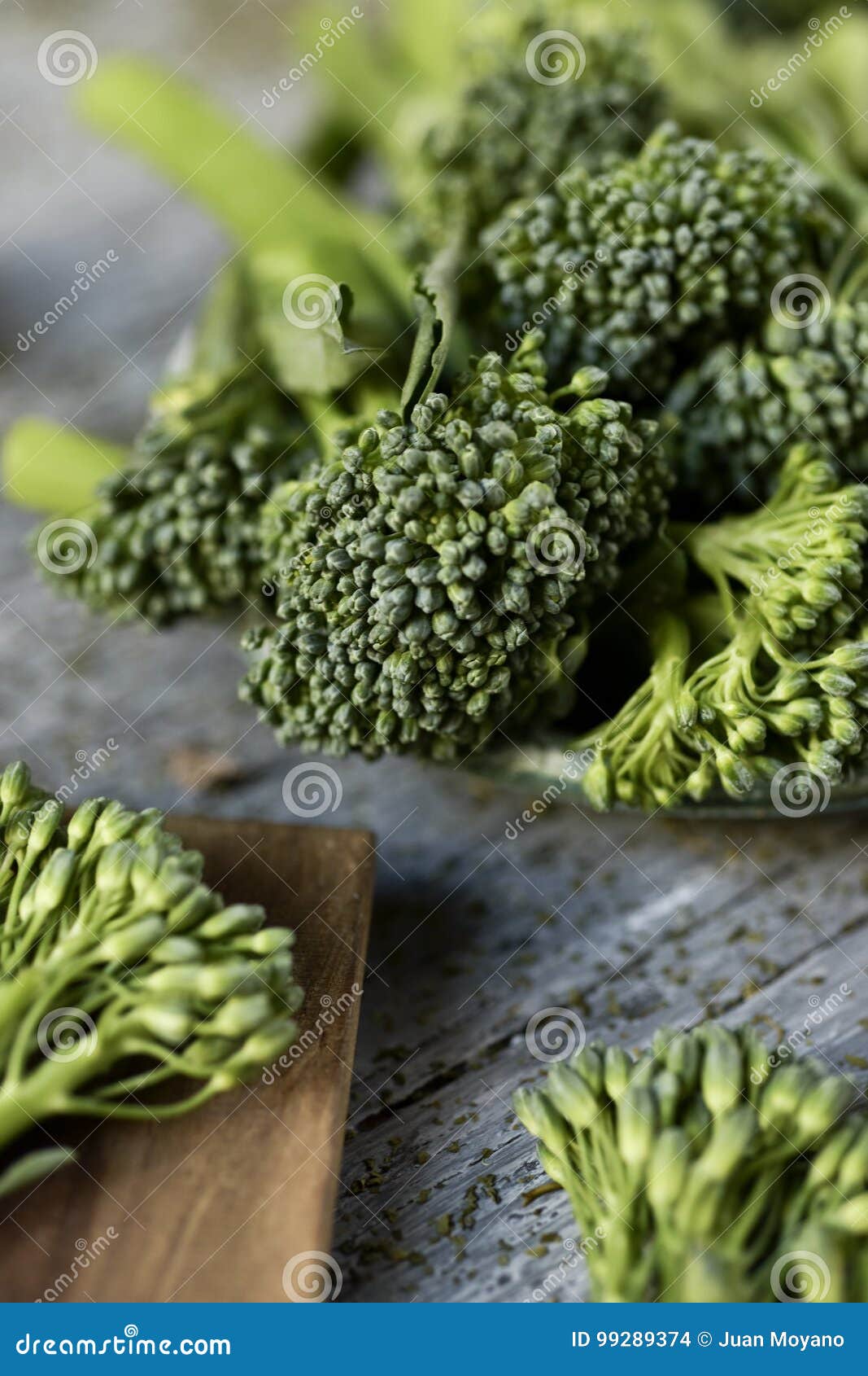 Stems of Raw Broccolini on a Rustic Table Stock Photo - Image of ...