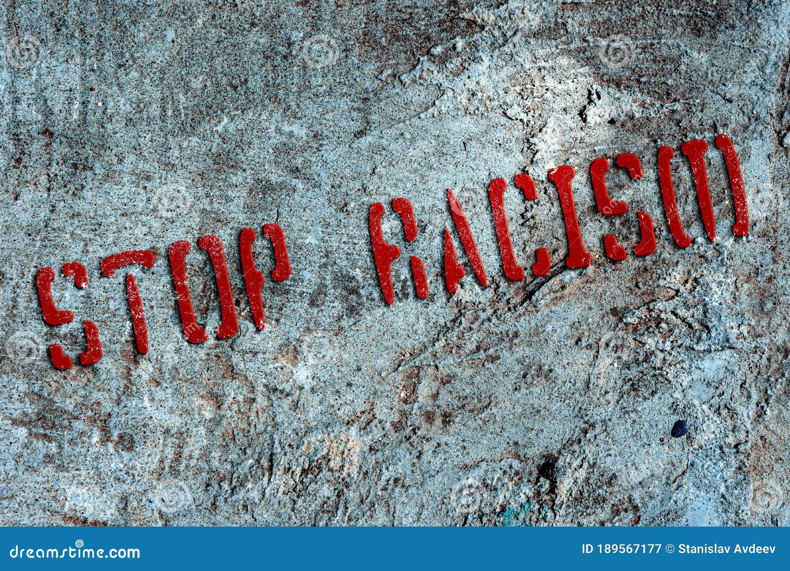 Stencil Stop Racism on an Old Concrete Wall. Background Stock ...