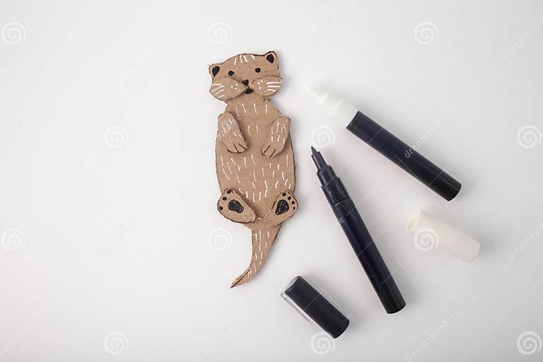 Step-by-step Process of Making an Otter-shaped Cardboard Craft ...