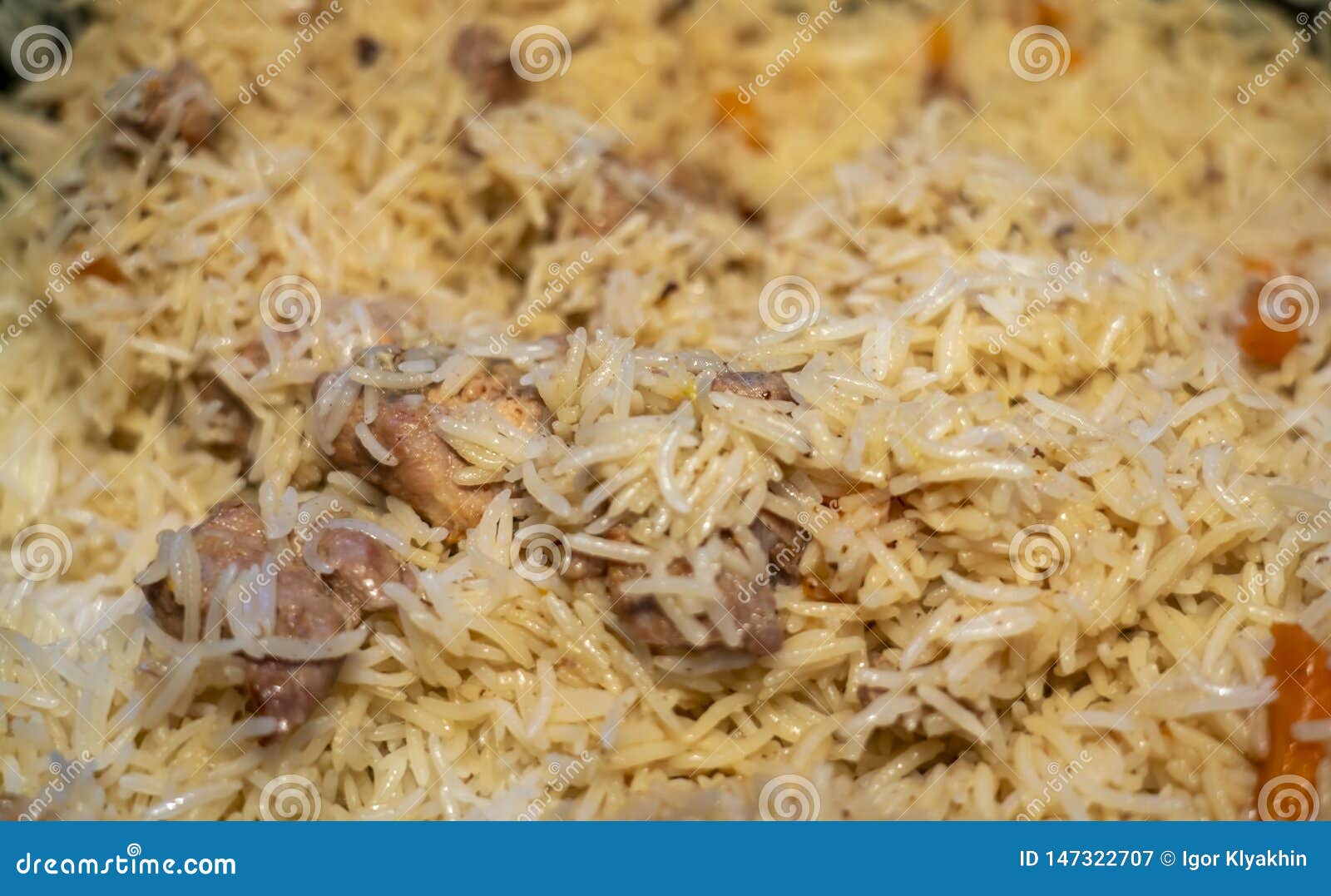 Step-by-step Process of Cooking Pilaf in a Cast Iron Cauldron Stock ...