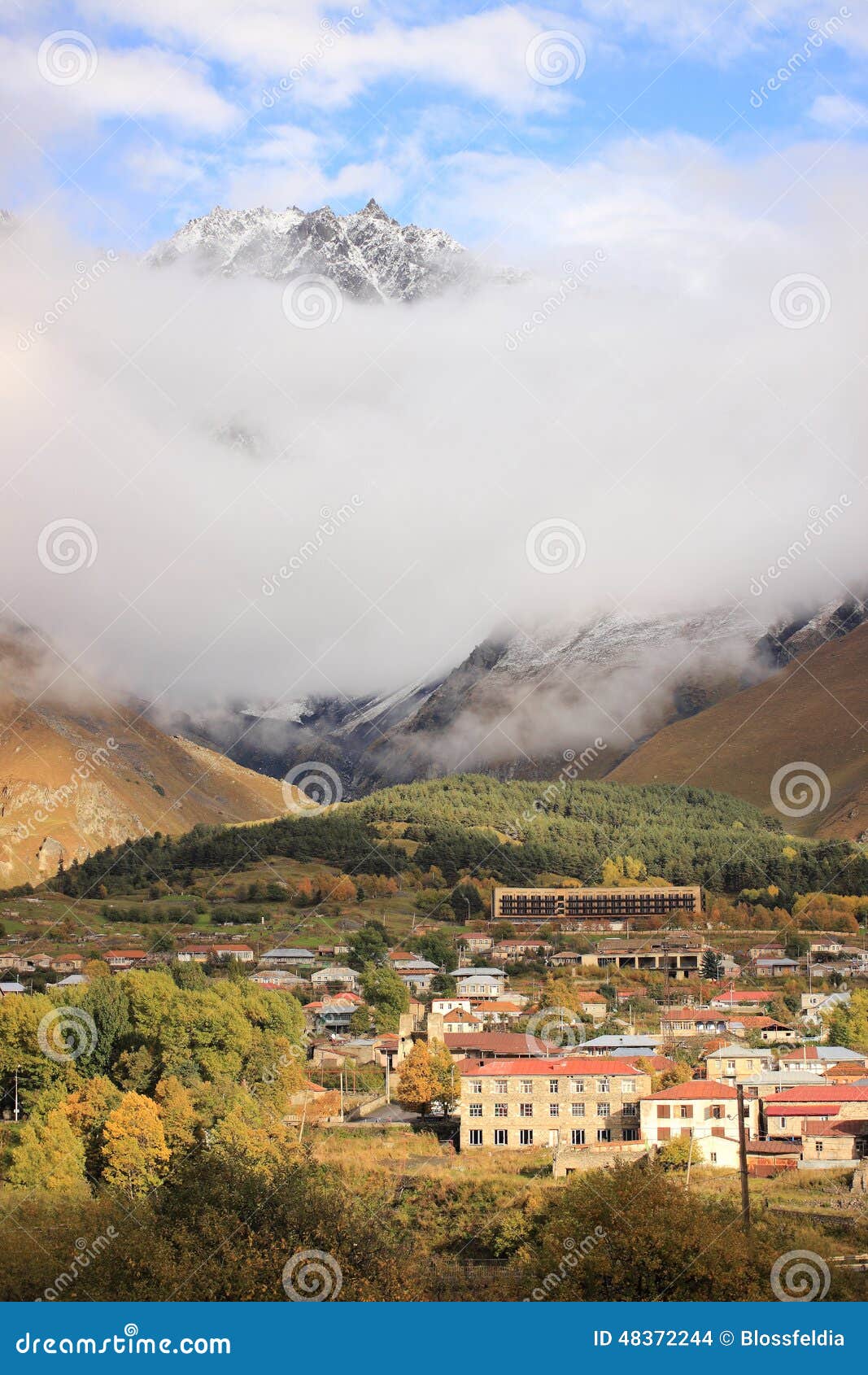 Stepantsminda town stock photo. Image of climbing, blue - 48372244