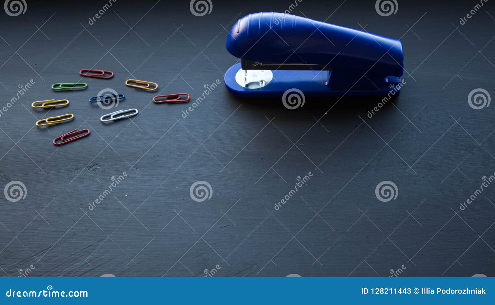 A Stapler and Colored Clips on Black Background Stock Image - Image of ...