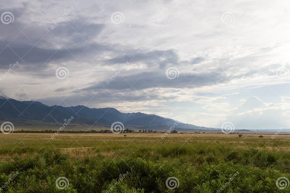 Steppes with mountains stock image. Image of beauty, sunrise - 76447713