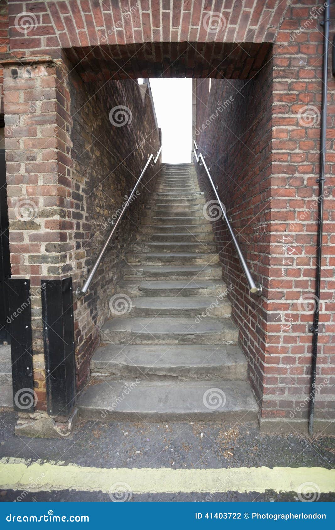 Steps through Brick Wall at London, England, UK Stock Photo - Image of ...