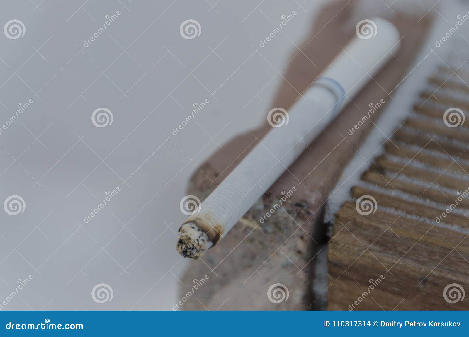 Burnt Cigarette Lies on the Step Stock Photo - Image of closeup ...