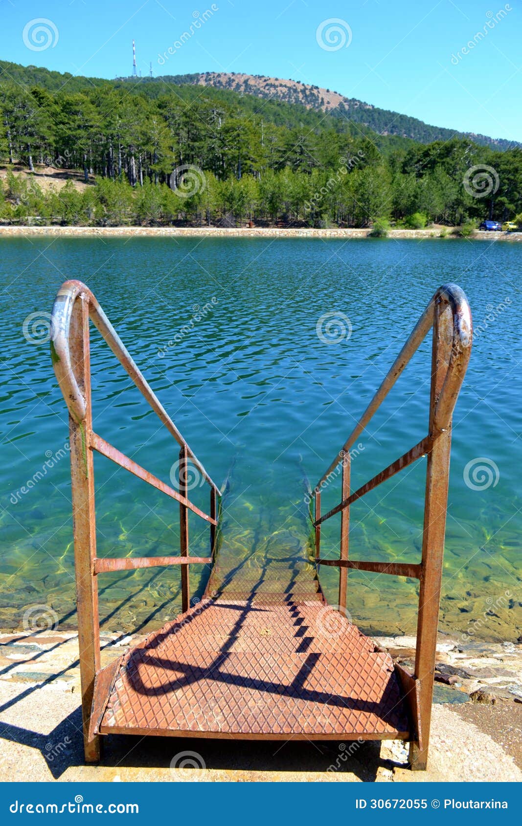 Steps to a lake stock image. Image of metal, water, reflection - 30672055