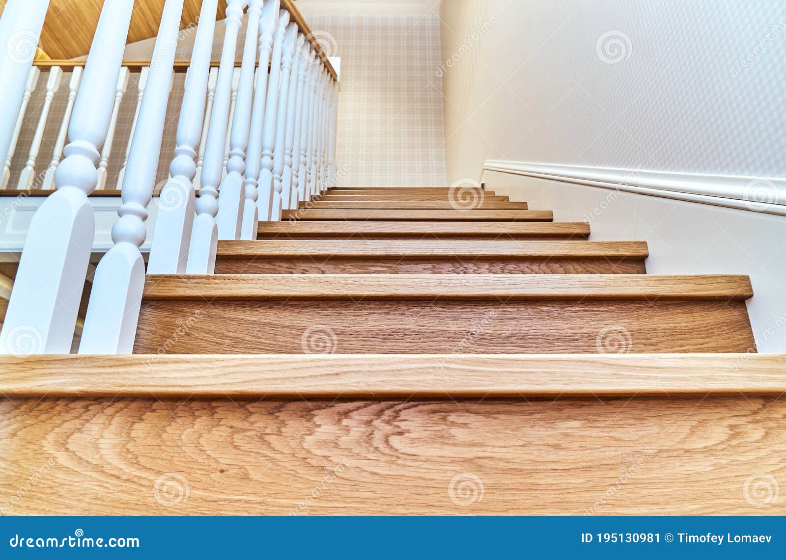 Steps of a Wooden Staircase with White Balusters. Bottom View Stock ...