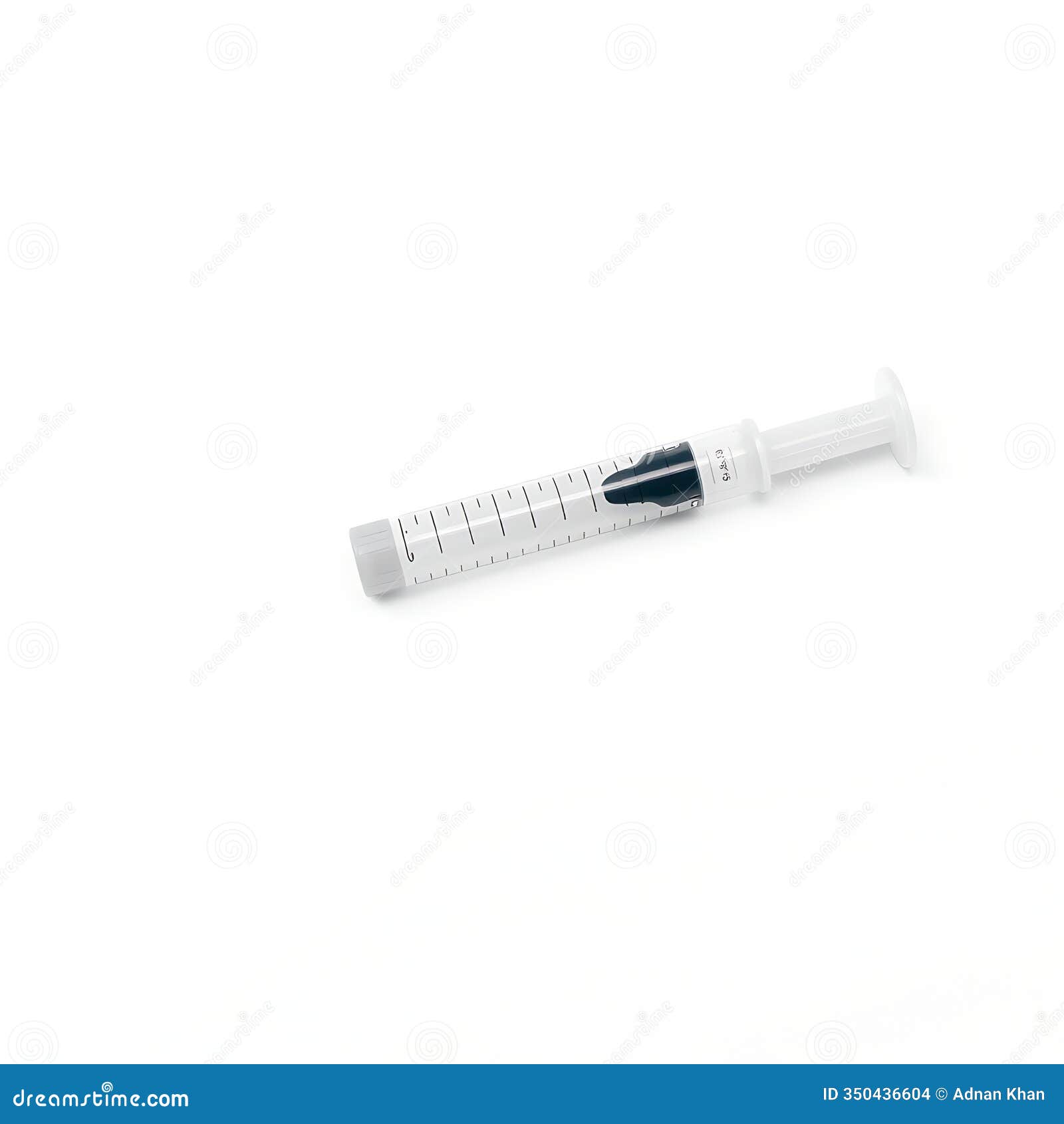 A Sterile Syringe with a Capped Needle Lying Flat on a White Surface ...