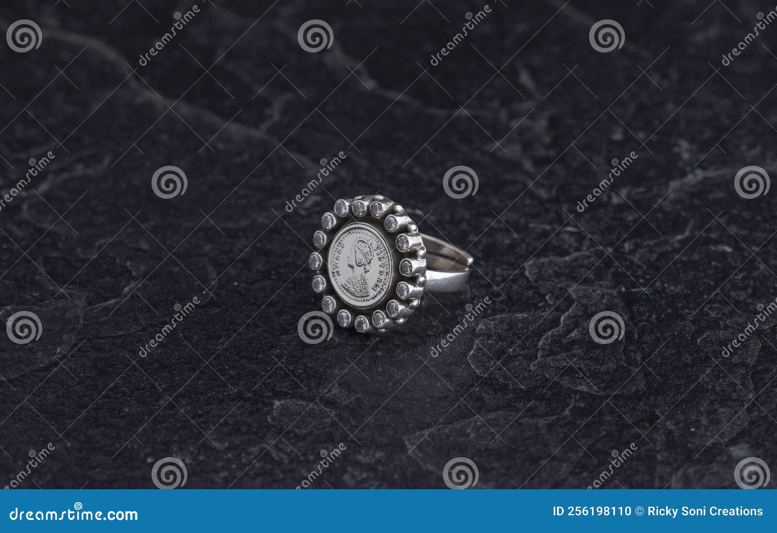 Sterling Silver Ring on Black Stone Background Stock Photo - Image of ...