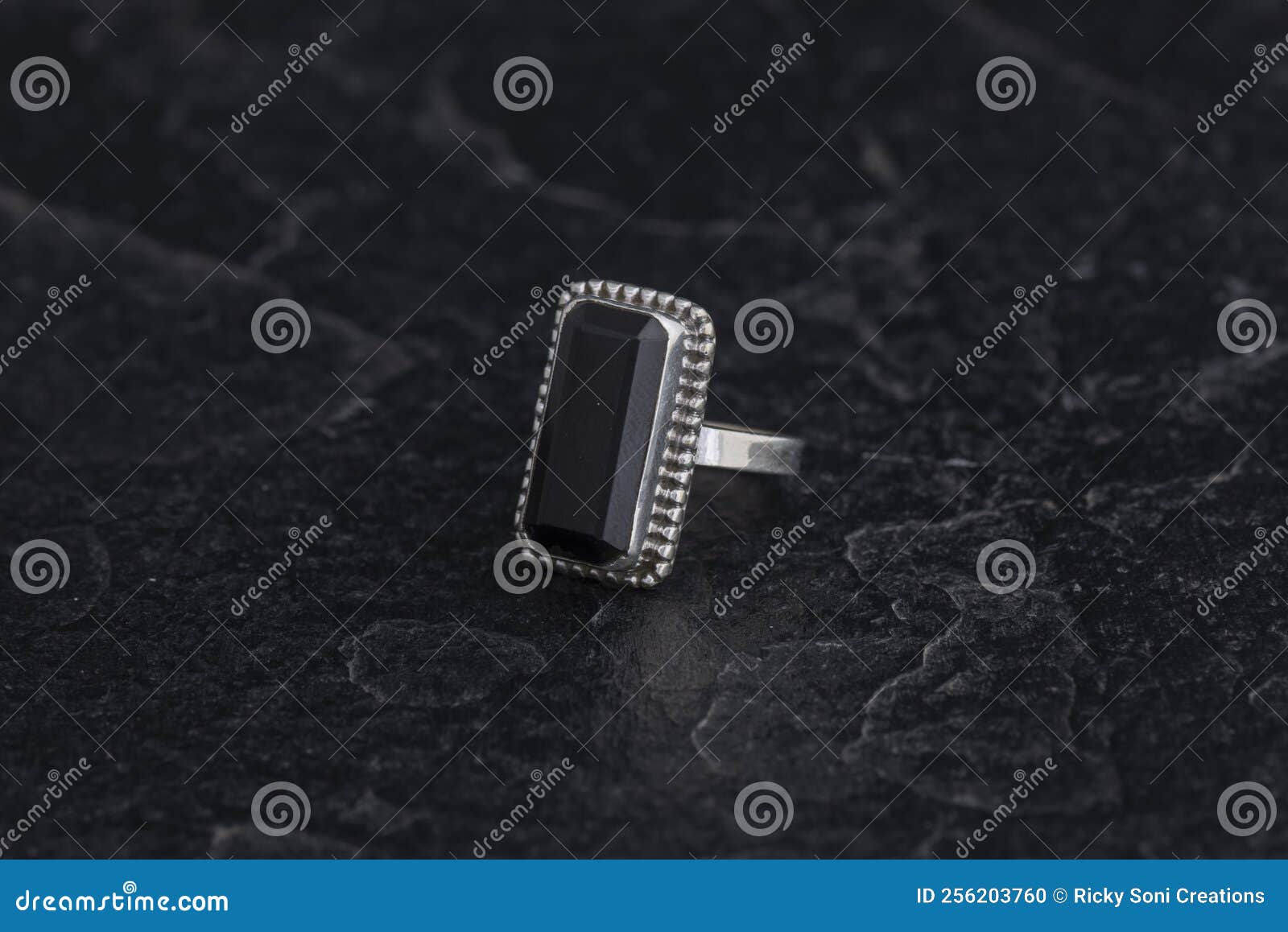 Sterling Silver Ring on Black Stone Background Stock Photo - Image of ...