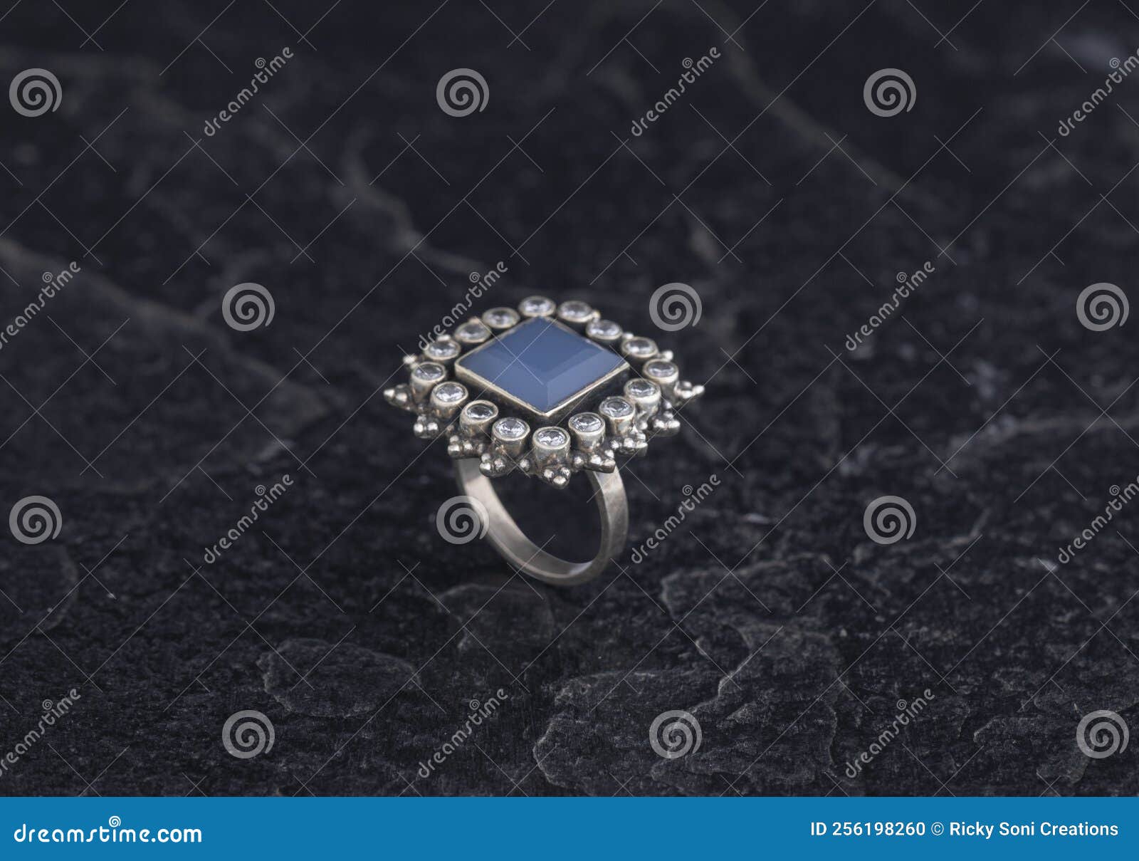 Sterling Silver Ring on Black Stone Background Stock Photo - Image of ...