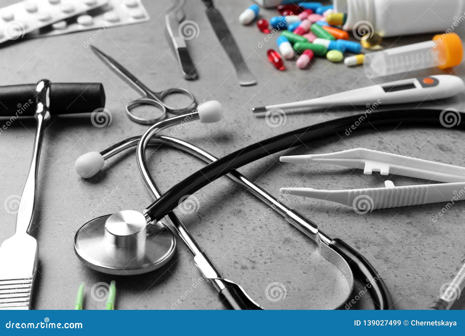 Stethoscope and Different Medical Objects on Grey Table Stock Image ...