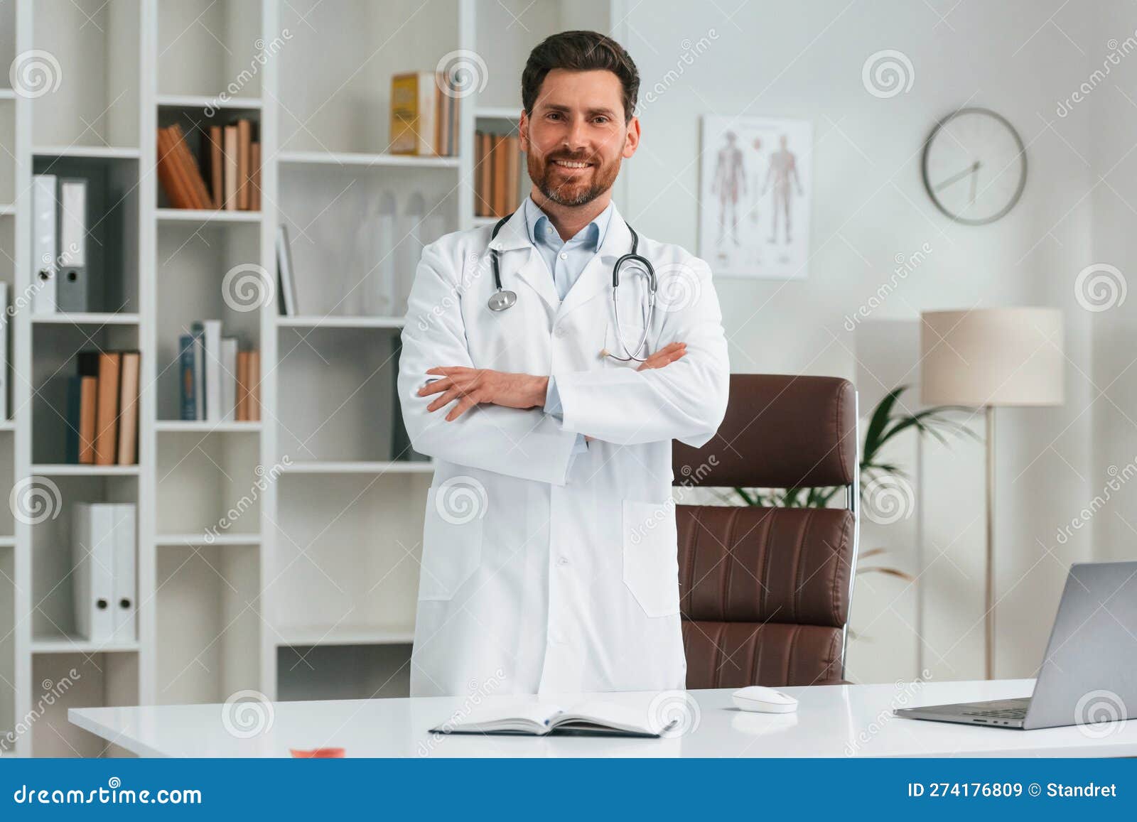 With Stethoscope. Doctor in Formal Clothes is Working in the Cabinet ...