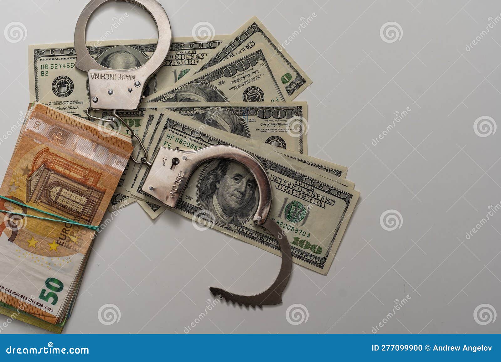 Handcuffs, Money On The Background Of The Ownership Certificates ...