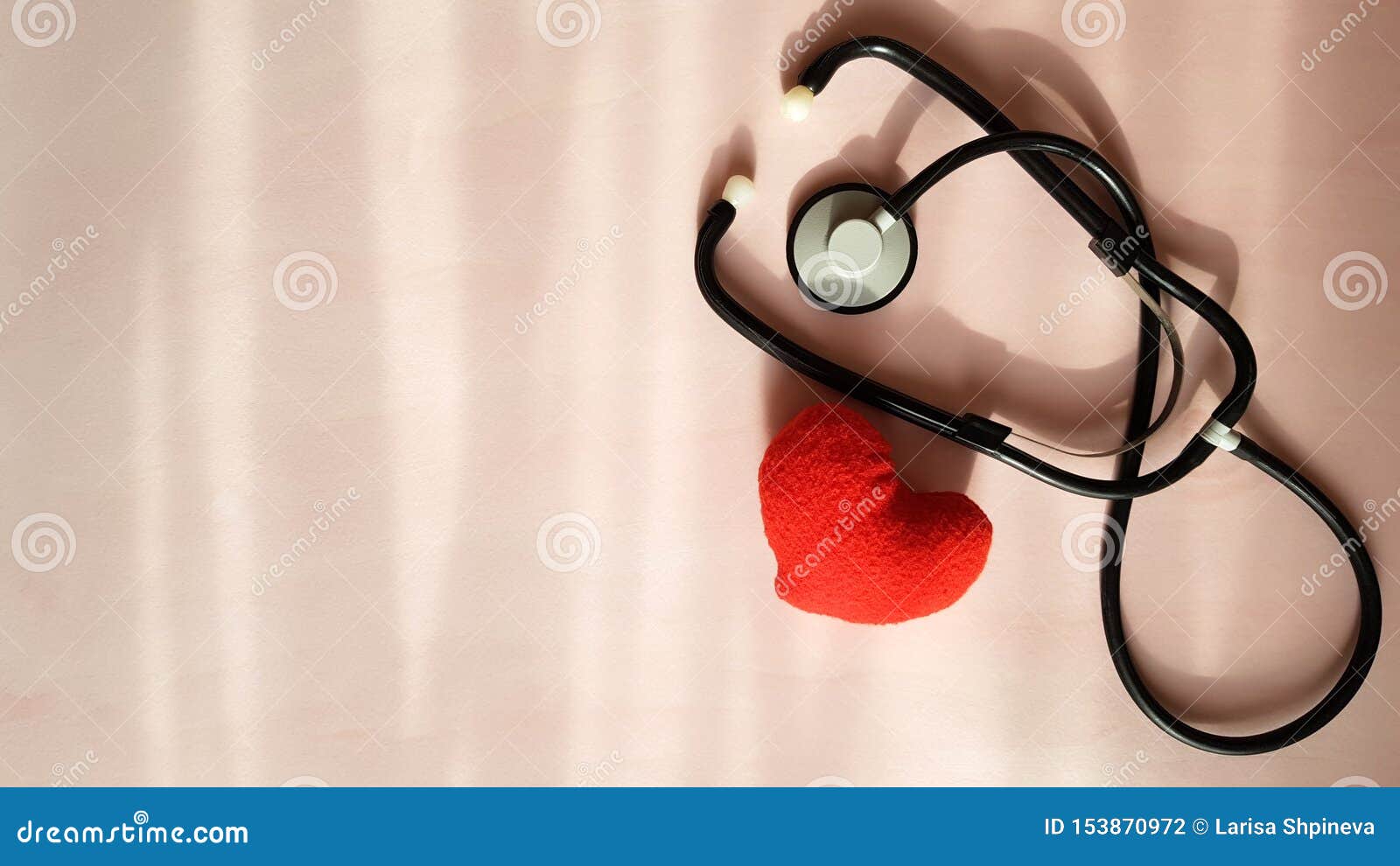 Stethoscope And Red Heart On Natural Light Sources Background Top View
