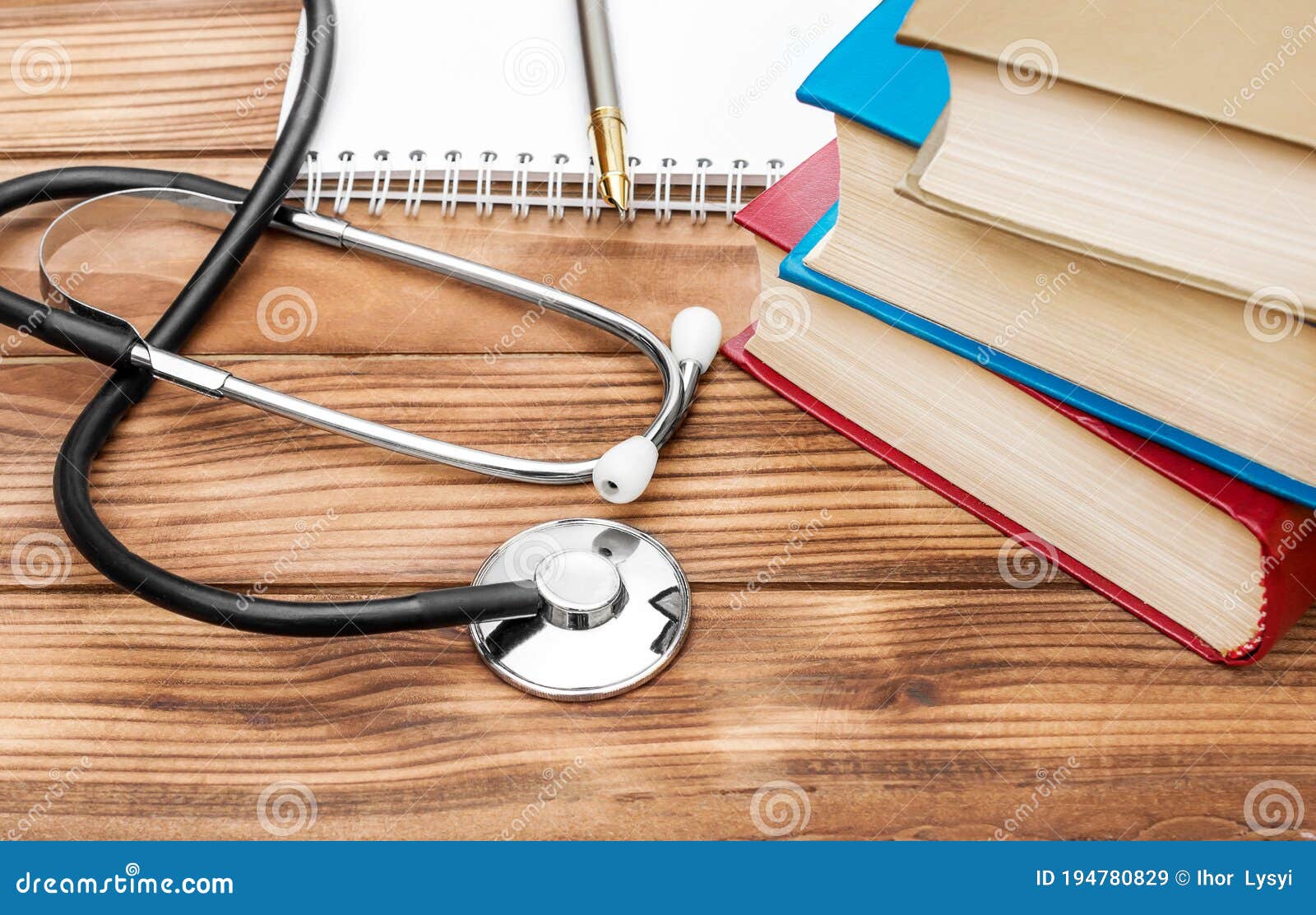 Stethoscope with Stack of Books and Notepad on the Table Stock Image ...