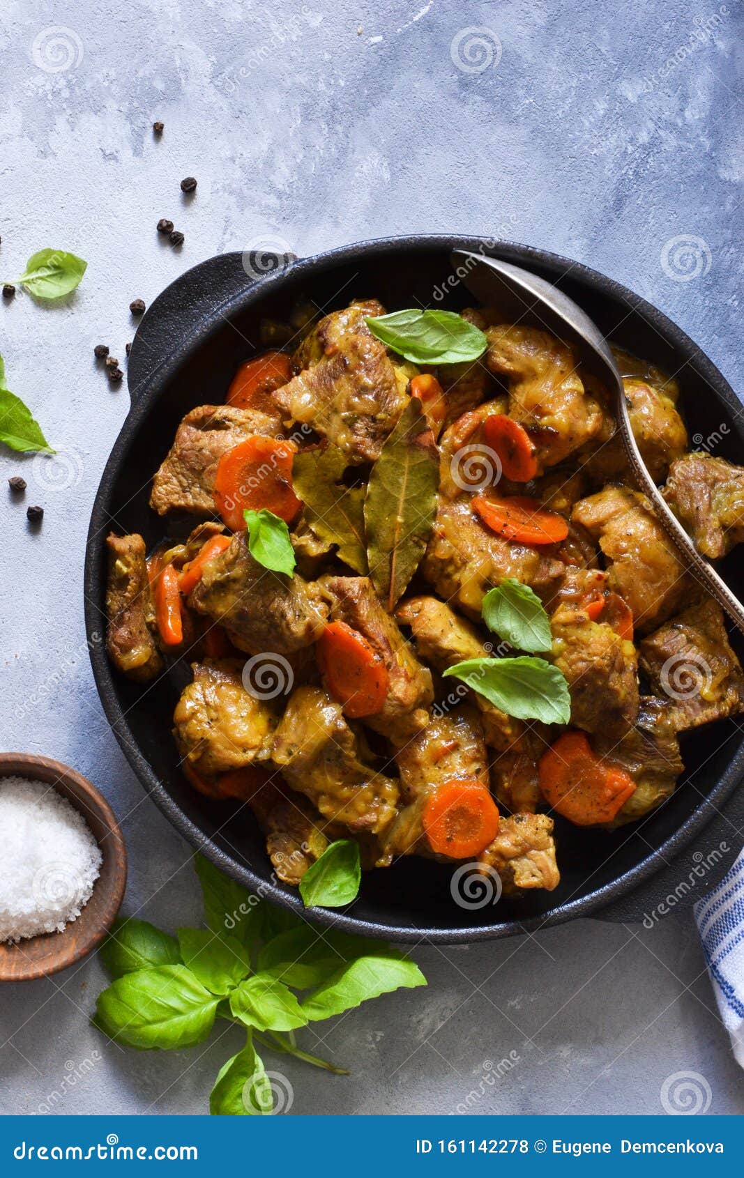 Stew with Spices in a Pan on a Concrete Background. View from Above ...