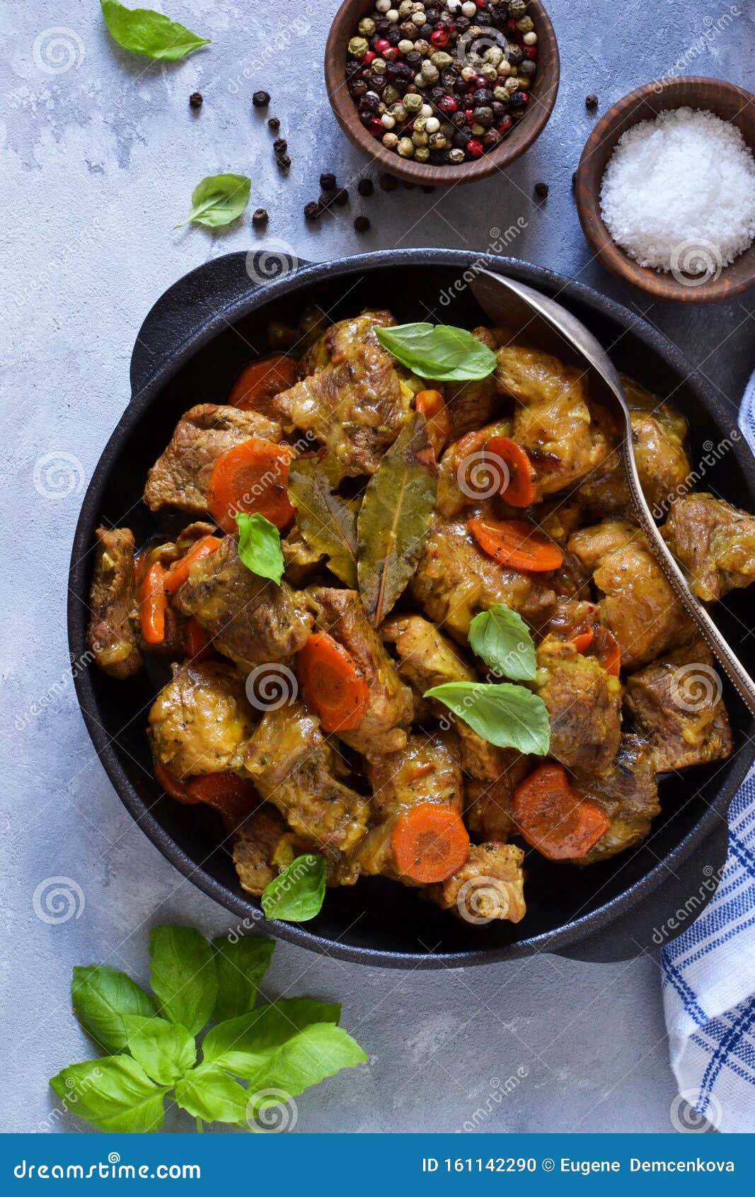 Stew with Spices in a Pan on a Concrete Background. View from Above ...