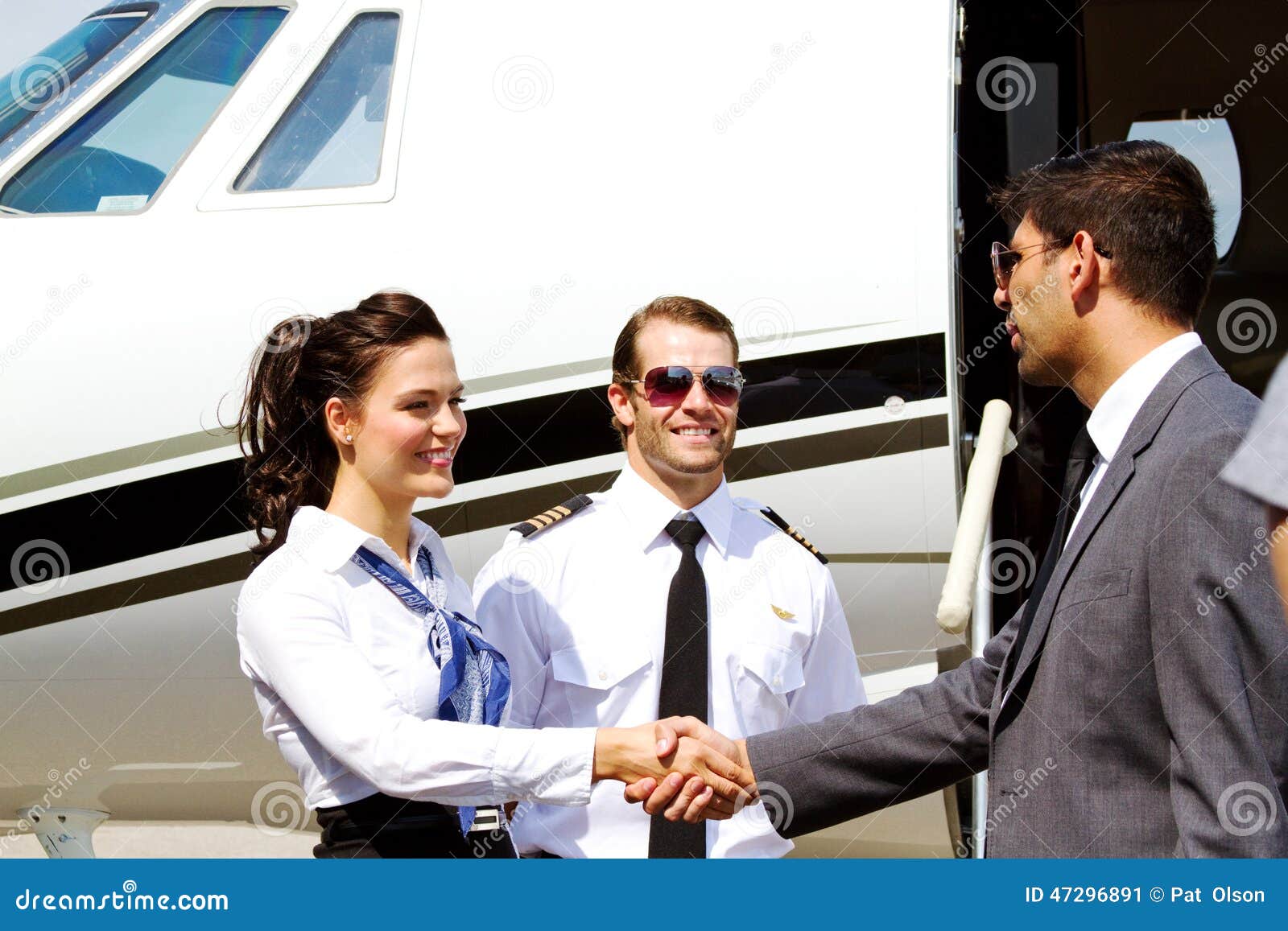 Stewardess and Pilot Greeting Passenger Stock Image - Image of airplane ...