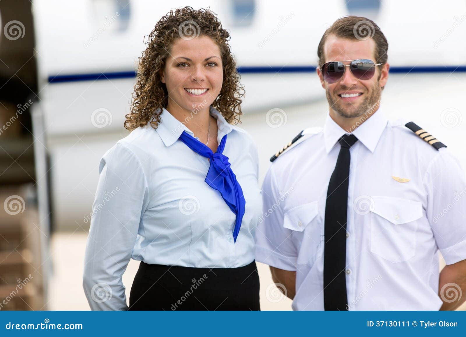 Stewardess and Pilot Standing Against Private Jet Stock Image - Image ...