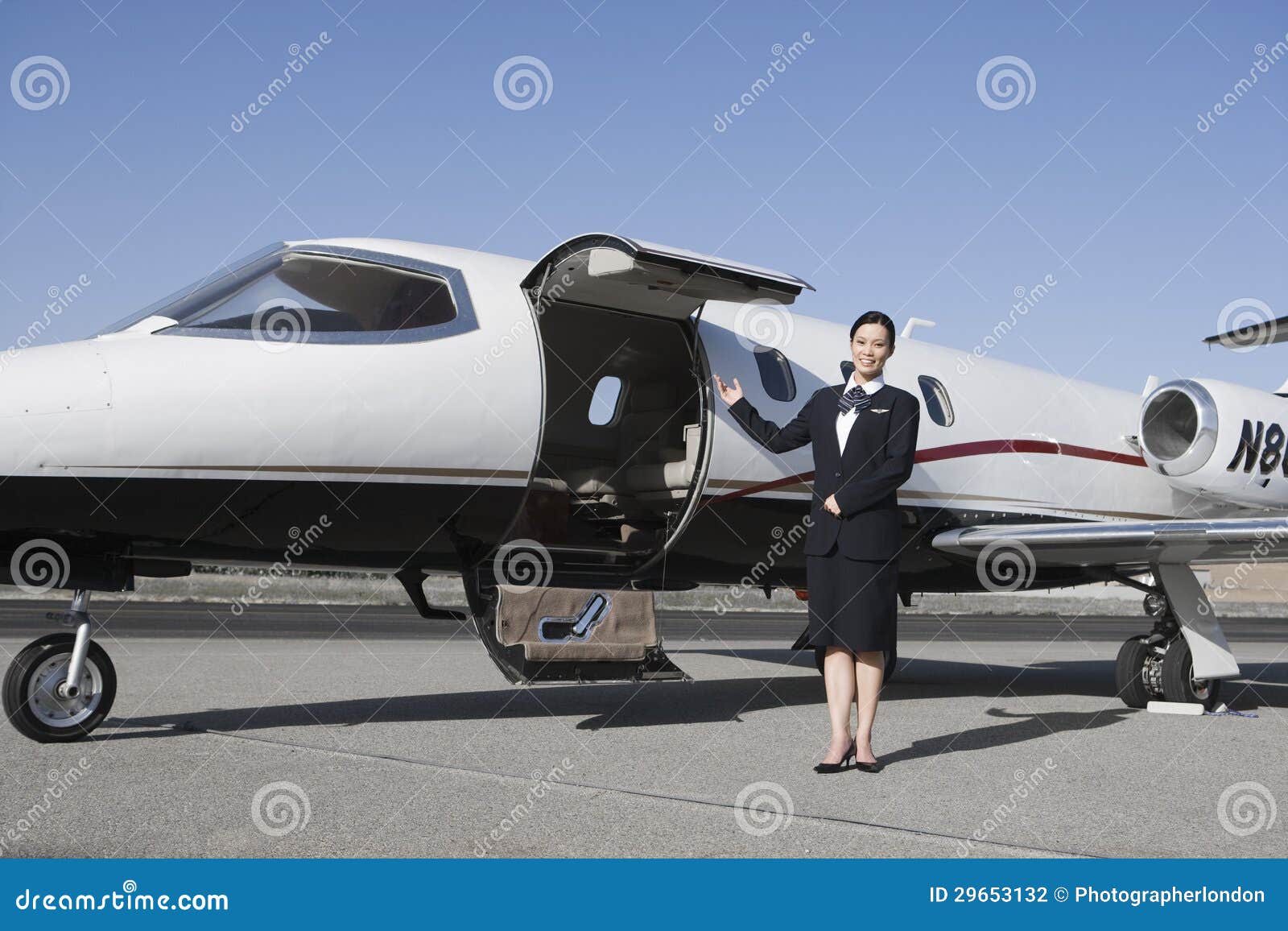 Stewardess Standing by Airplane at Airfield Stock Photo - Image of ...