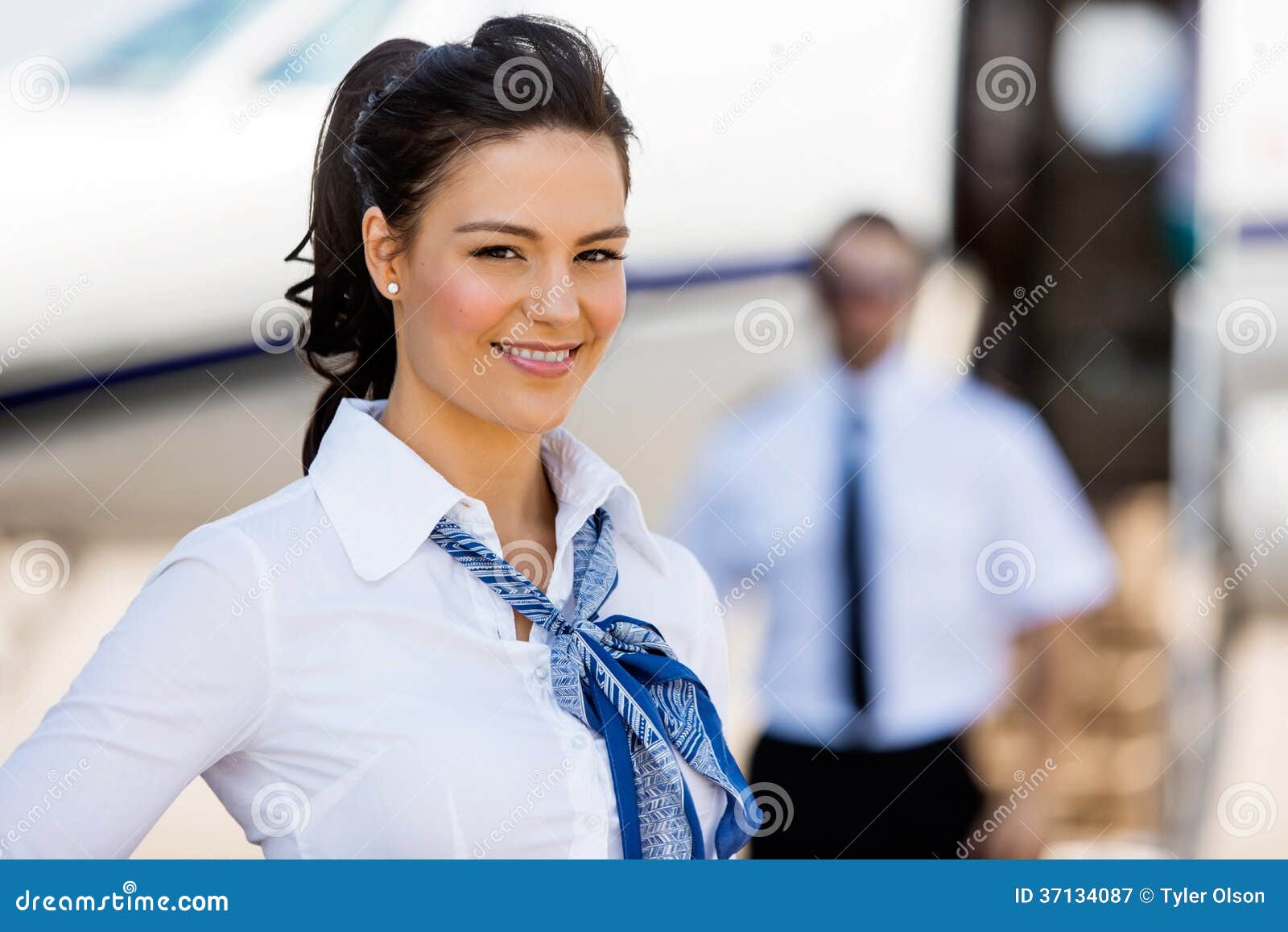 Stewardesses Smiling with Pilot and Private Jet in Stock Image - Image ...