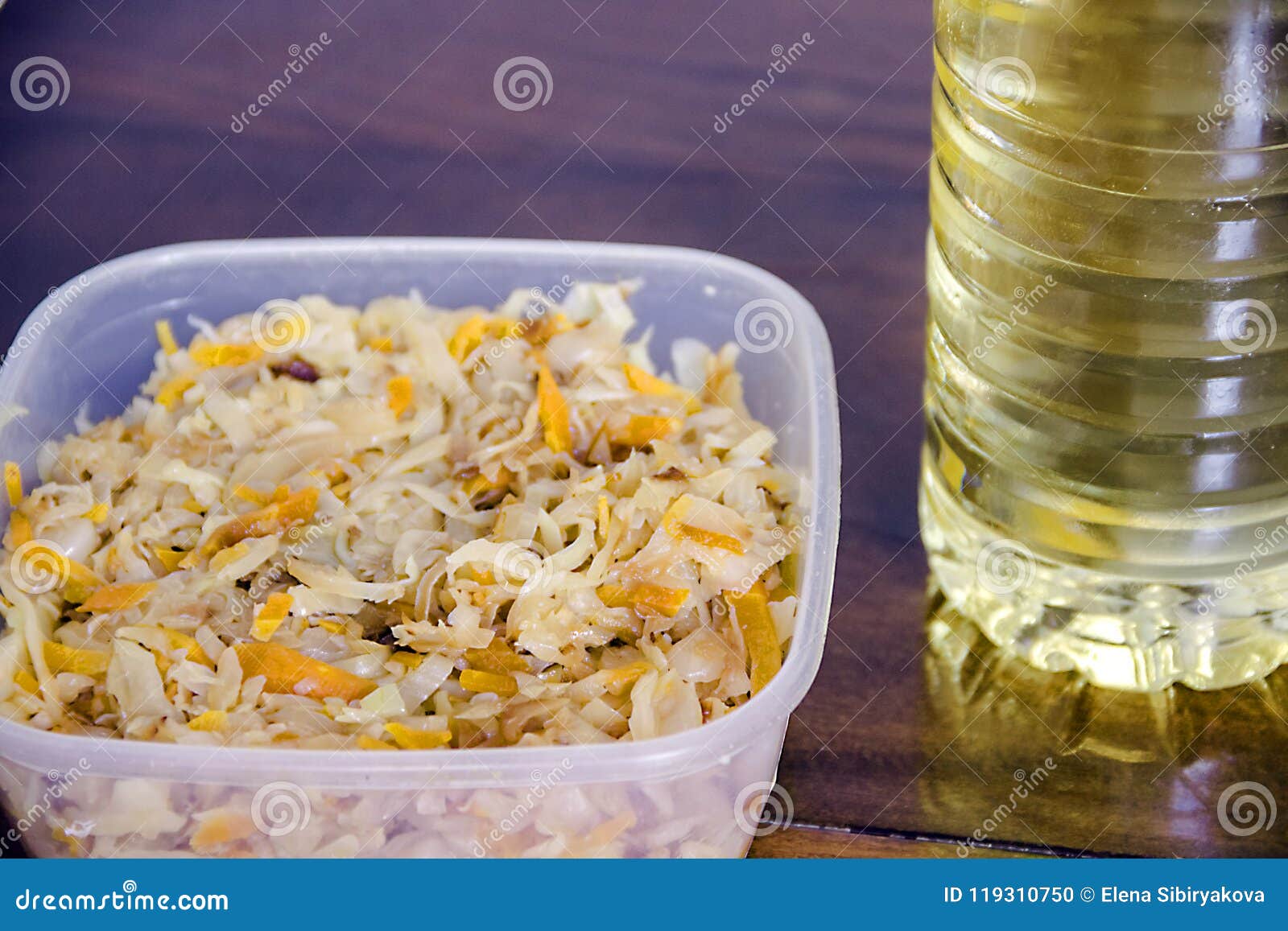 Stewed Cabbage and a Bottle of Vegetable Oil on the Table Stock Photo ...