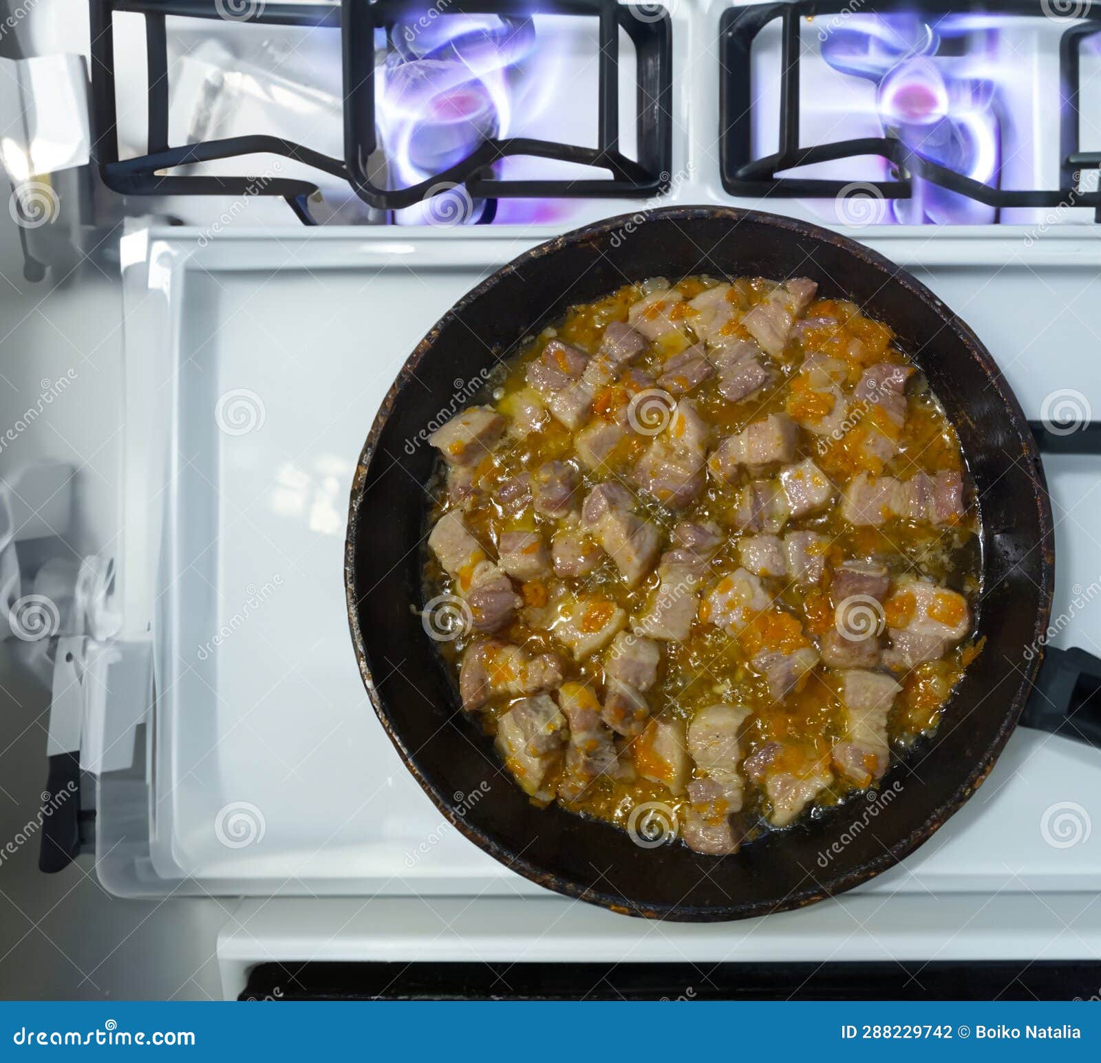 Stewed Meat and Vegetables in a Black Frying Pan. View from Above ...