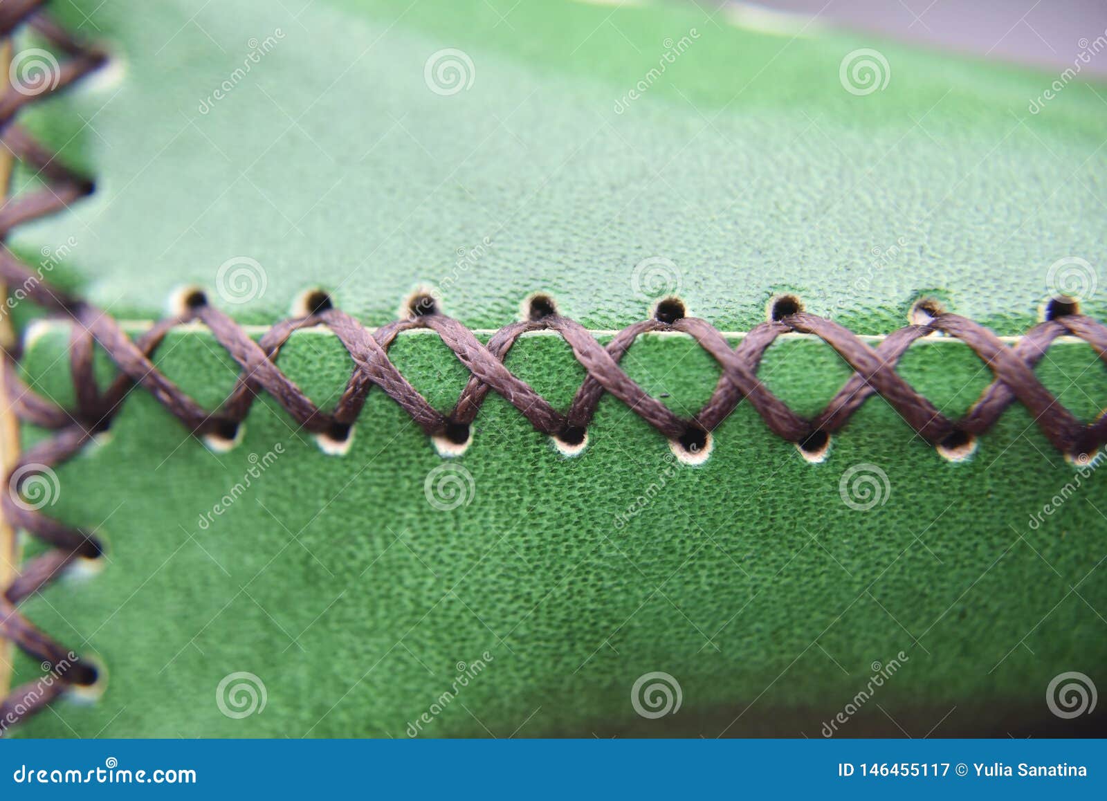 The Stich on the Green Leather Stock Image - Image of bags, cross ...