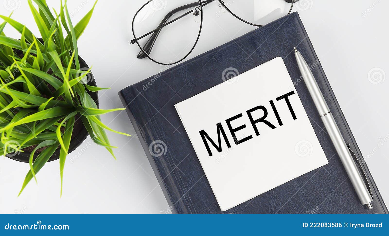 Stickers on Notebook Text MERIT with Pen and Glasses on White ...