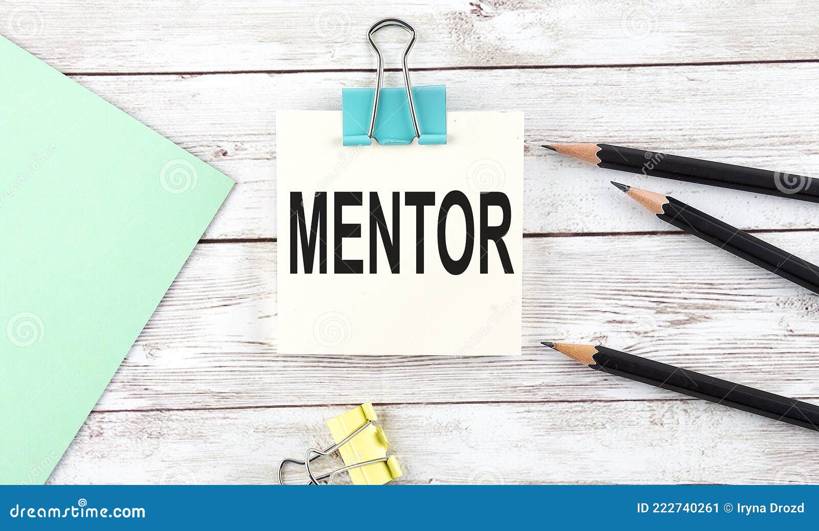 Stickers with Pencils and Notebook with Text MENTOR on Wooden ...