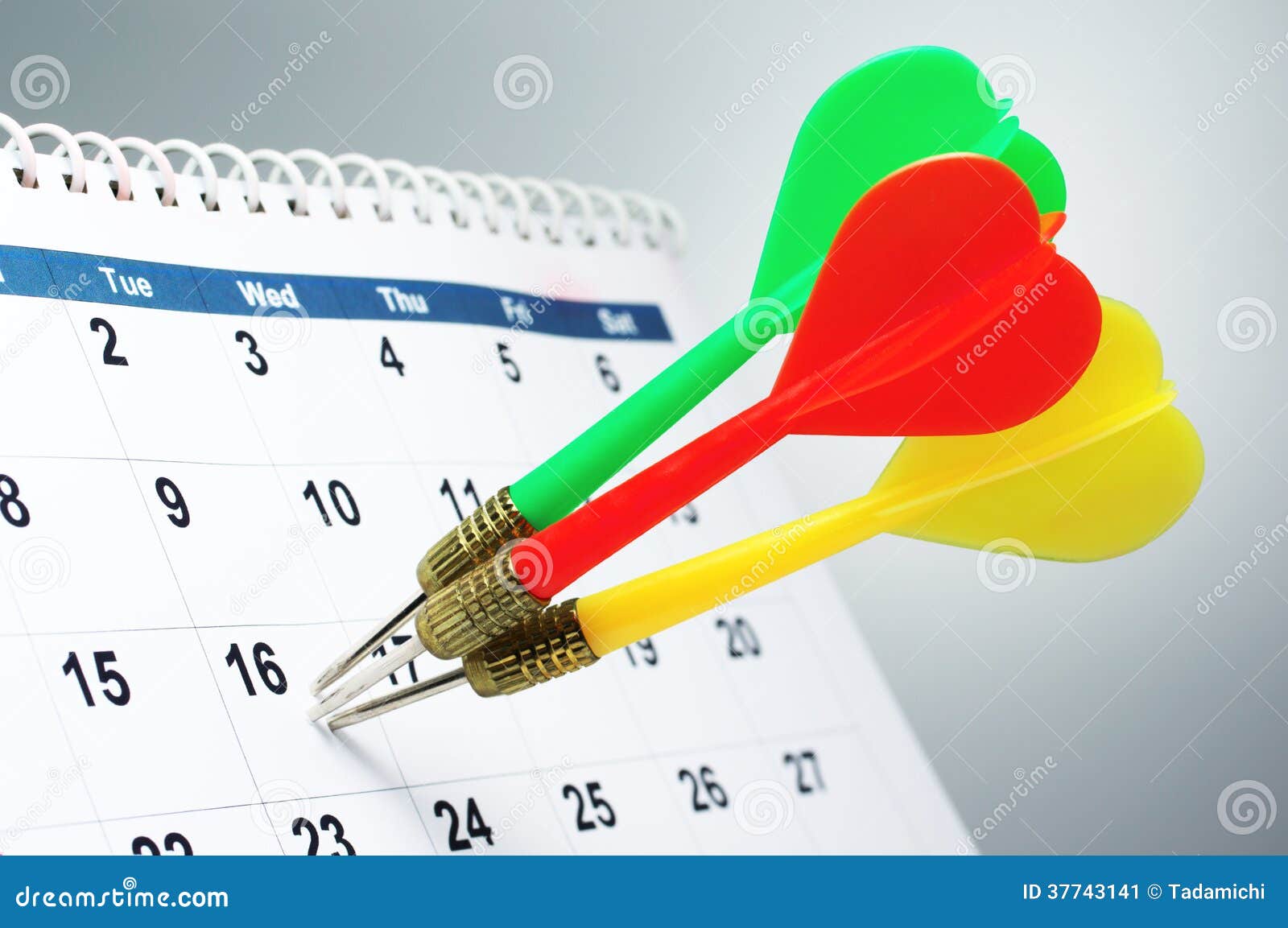 Sticking Three Arrows into Calendar. Stock Image - Image of week ...