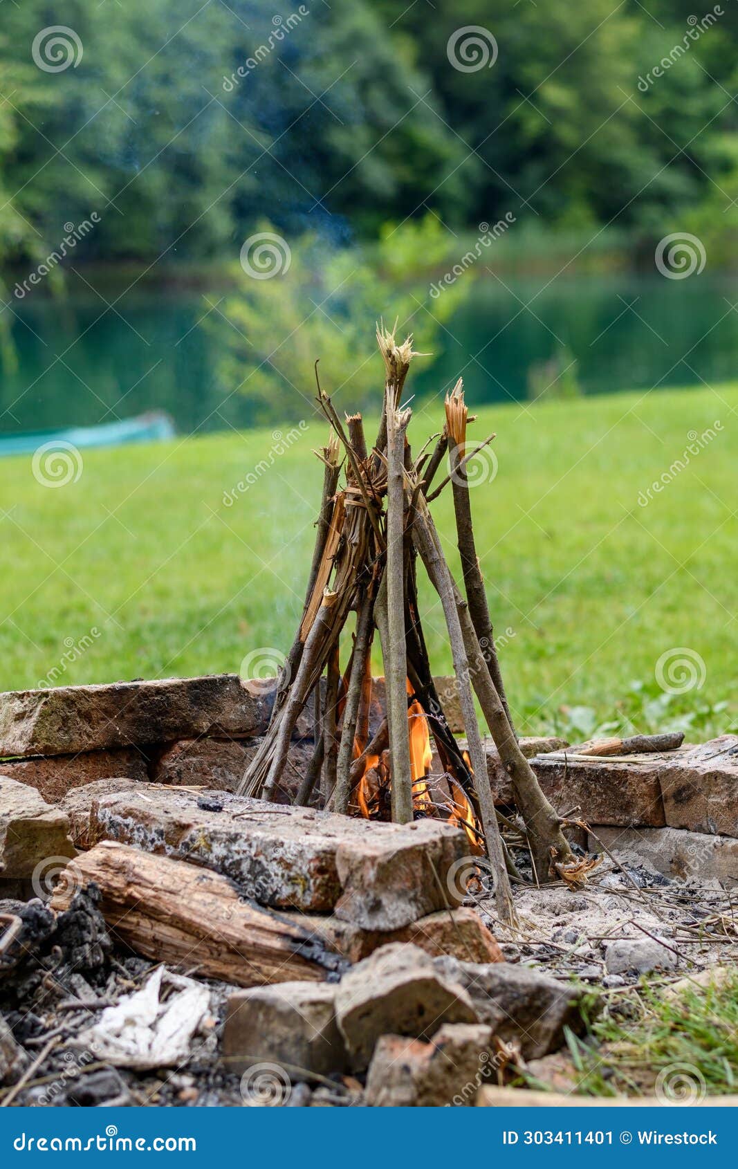Sticks and Branches Burning on Bonfire on River Bank Stock Image ...