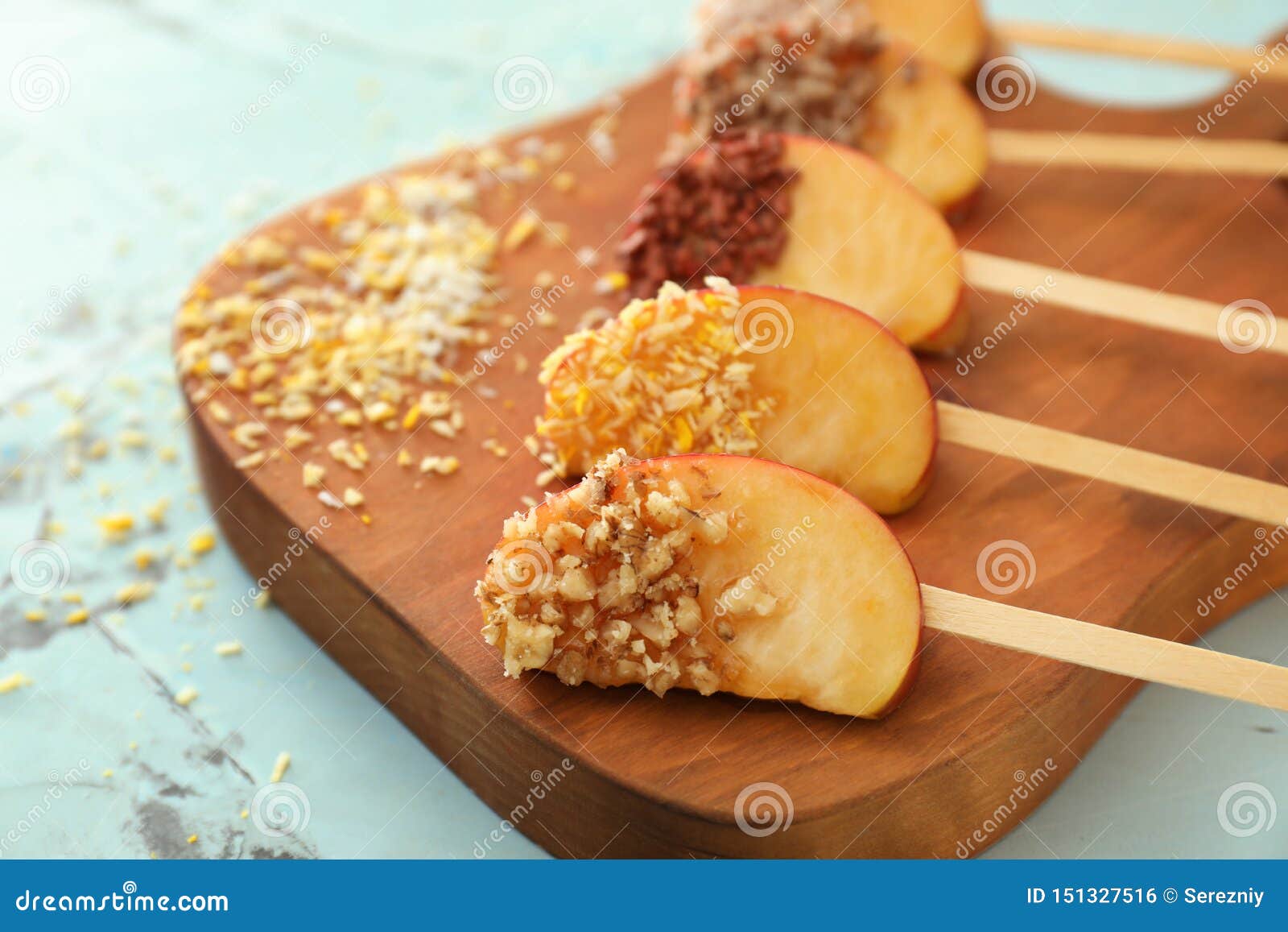 Sticks with Candy Apple Wedges on Wooden Board Stock Photo - Image of ...