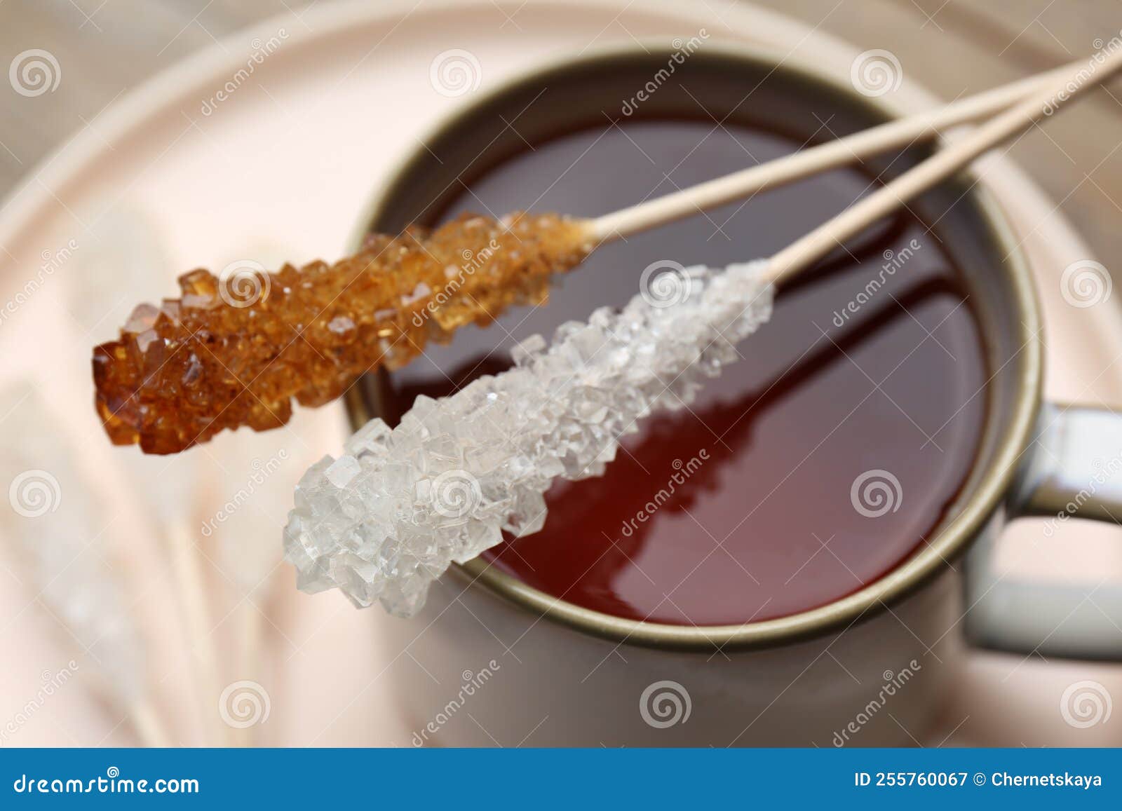 Sticks with Sugar Crystals and Cup of Tea on Table, Closeup Stock Image ...