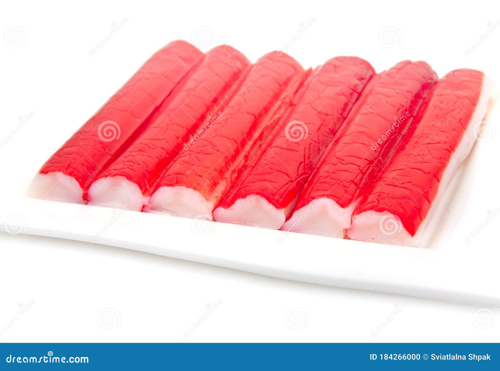 Sticks of Surimi on a Square Plate Isolated on White Stock Photo ...