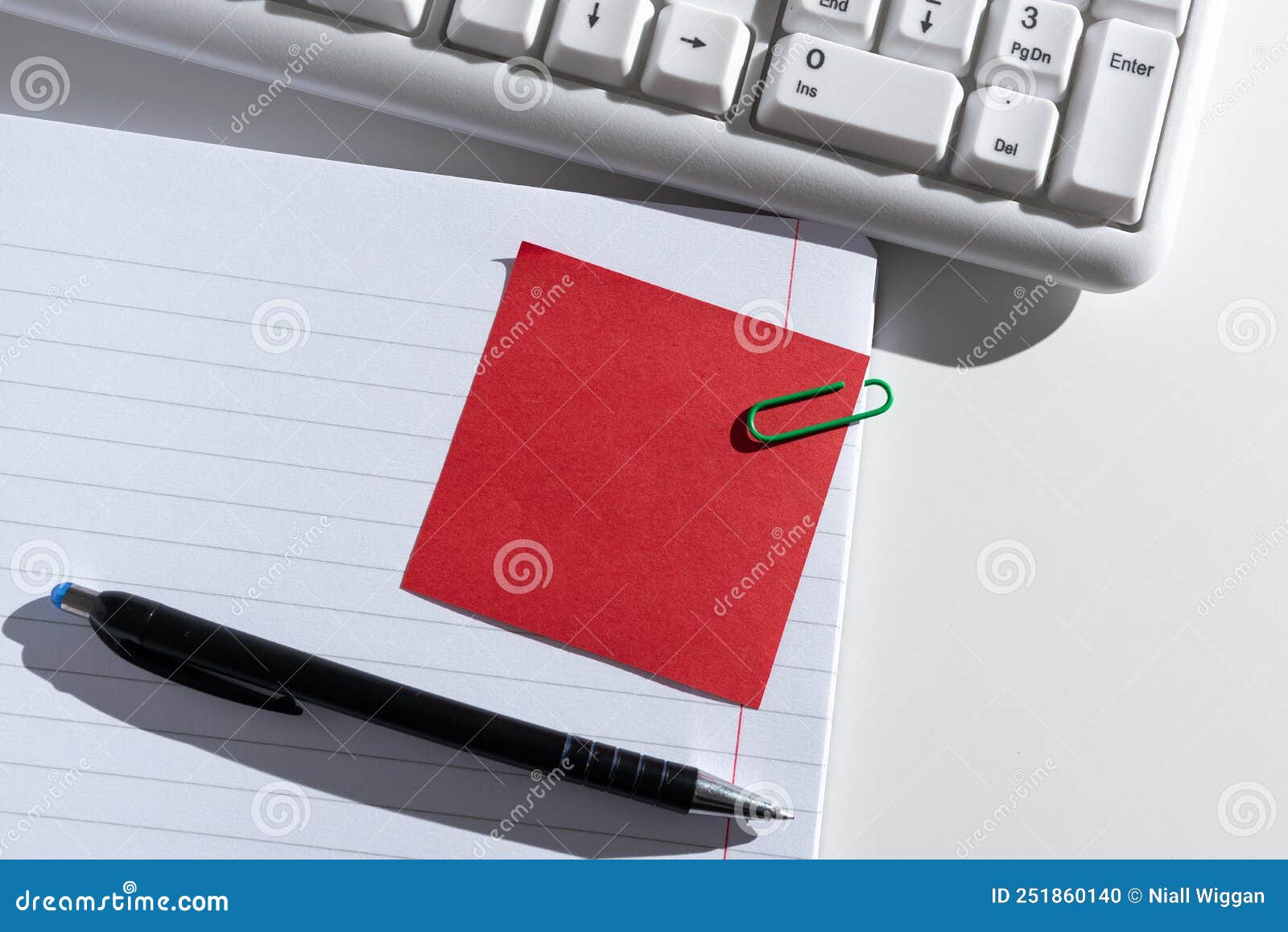 Sticky Note with Important Message Clipped on Opened Notebook on Desk ...