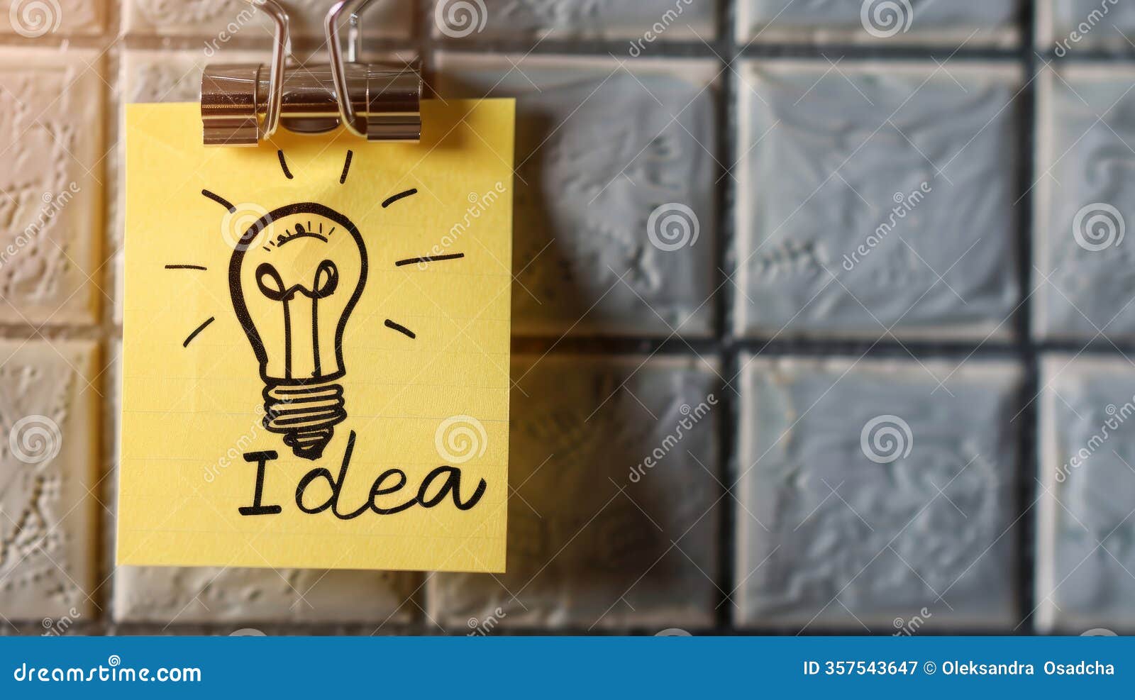 Sticky Note with Lightbulb Drawing and Idea Text Attached To Tiled Wall ...