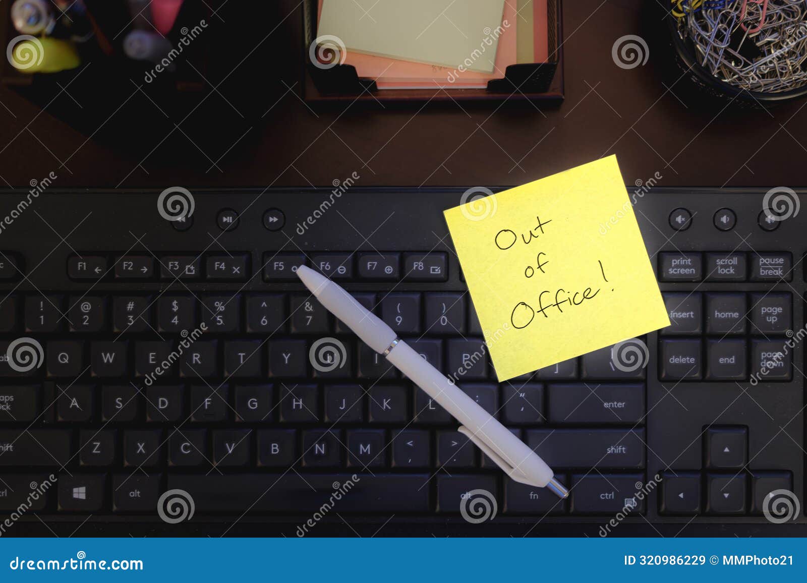 Sticky Note on Office Desk Saying "Out of Office" Stock Image - Image ...