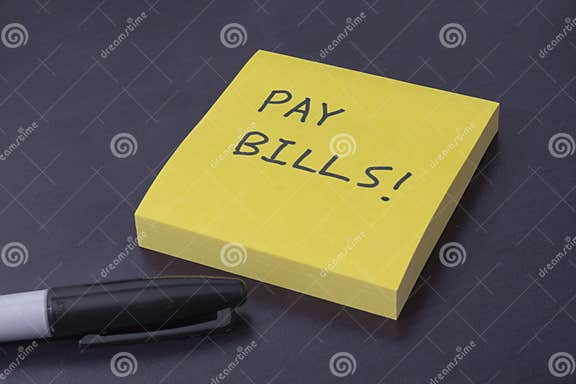Sticky Note Pad with the Reminder To Pay Bills Stock Photo - Image of ...