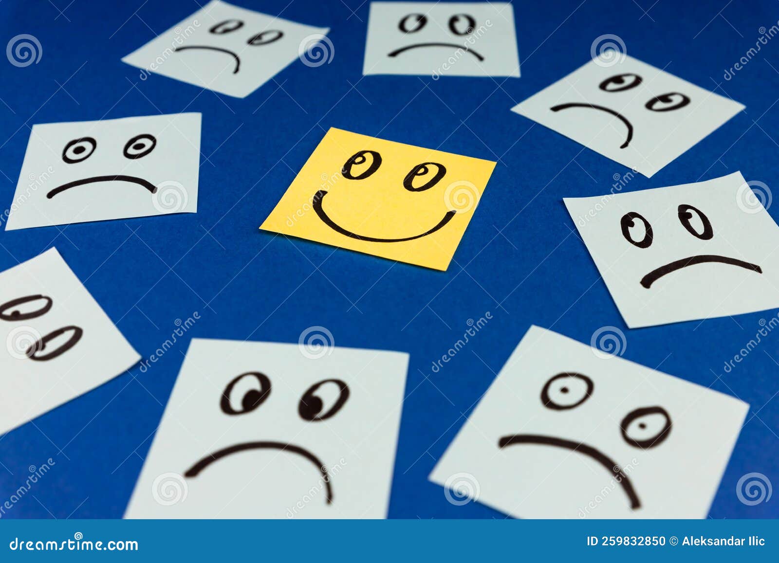 Sticky Notes with Hand Drawn Smiley Face and Sad Faces on Blue ...
