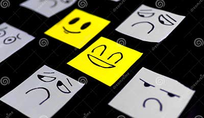 Sticky Notes with Sad Faces Surround Two Yellow Notes with Smiley Faces ...