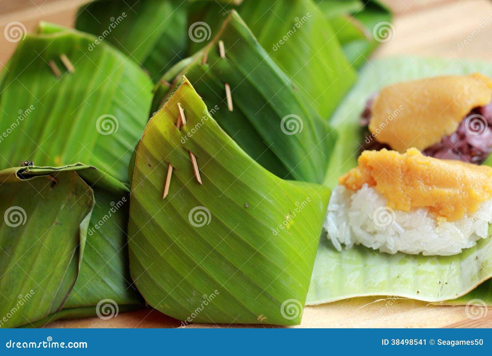 Sticky Rice with Custard Wrapped in Banana Leaves. Stock Image - Image ...