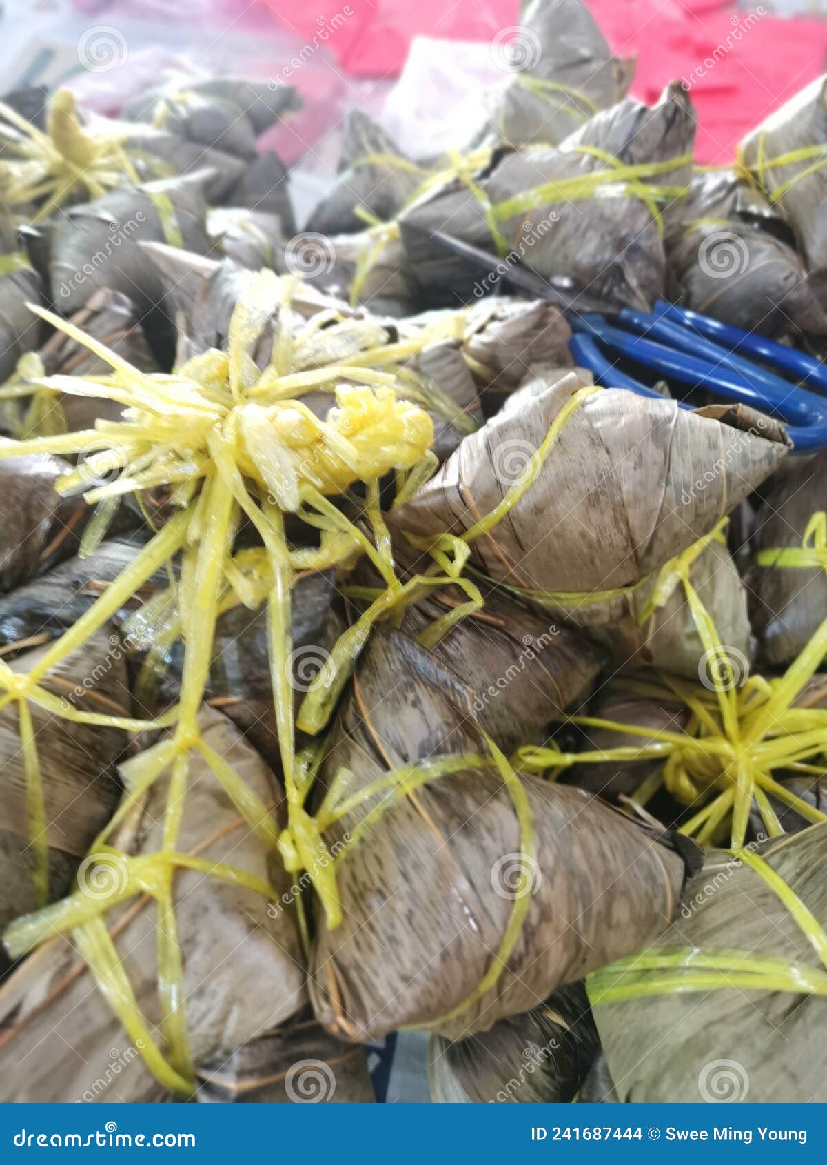 Sticky Rice with Meat Filling Wrapped with Bamboo Leaf Dumplings. Stock ...