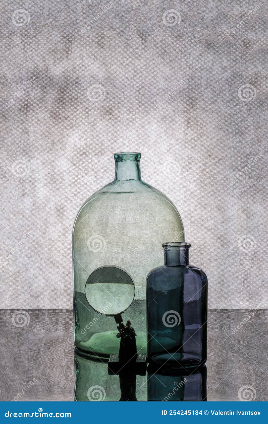Still Life with Glass Jars and Magnifying Glass Stock Photo - Image of ...