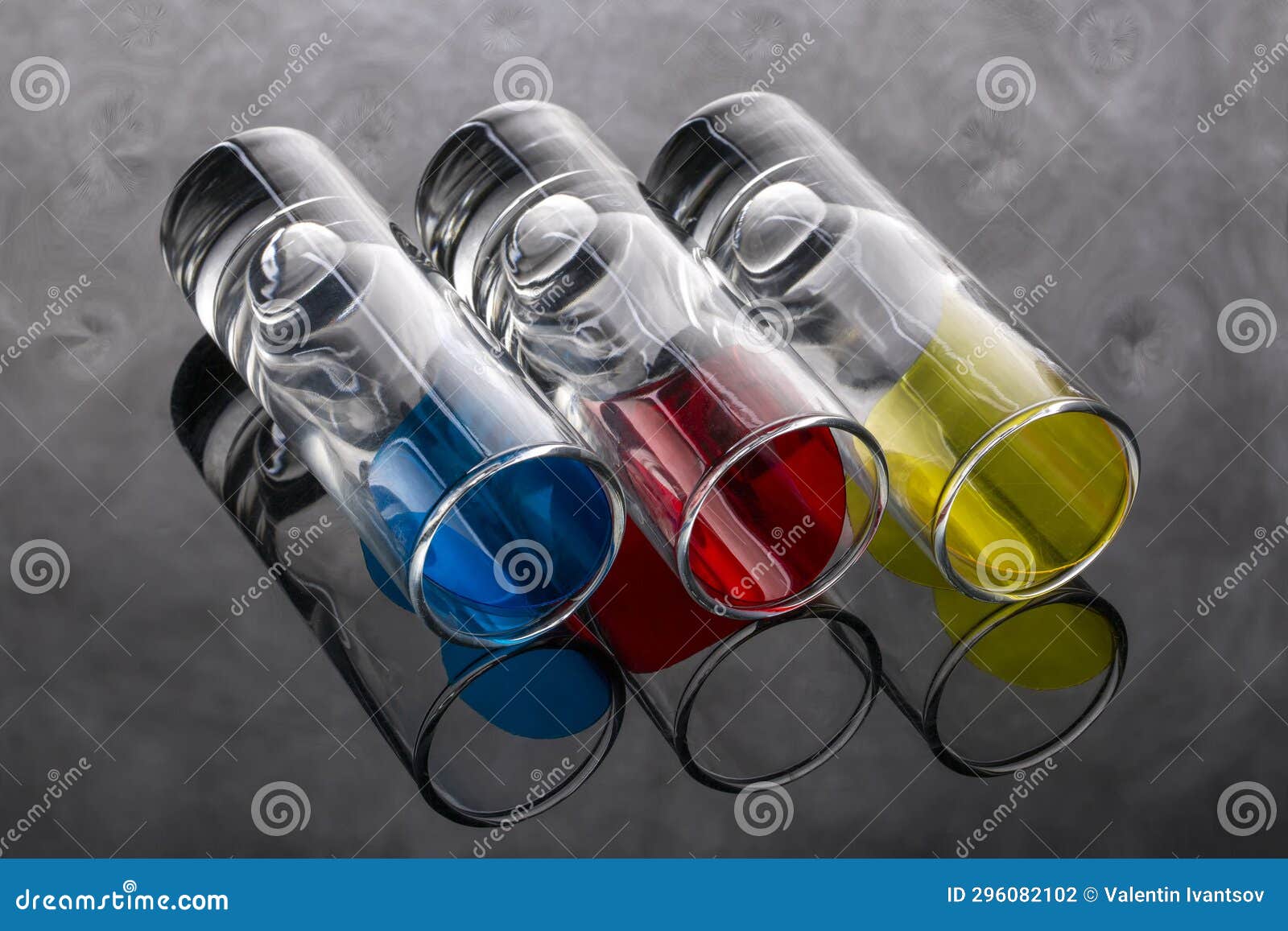 Still Life with Glass Objects with Colored Spots on a Reflective ...